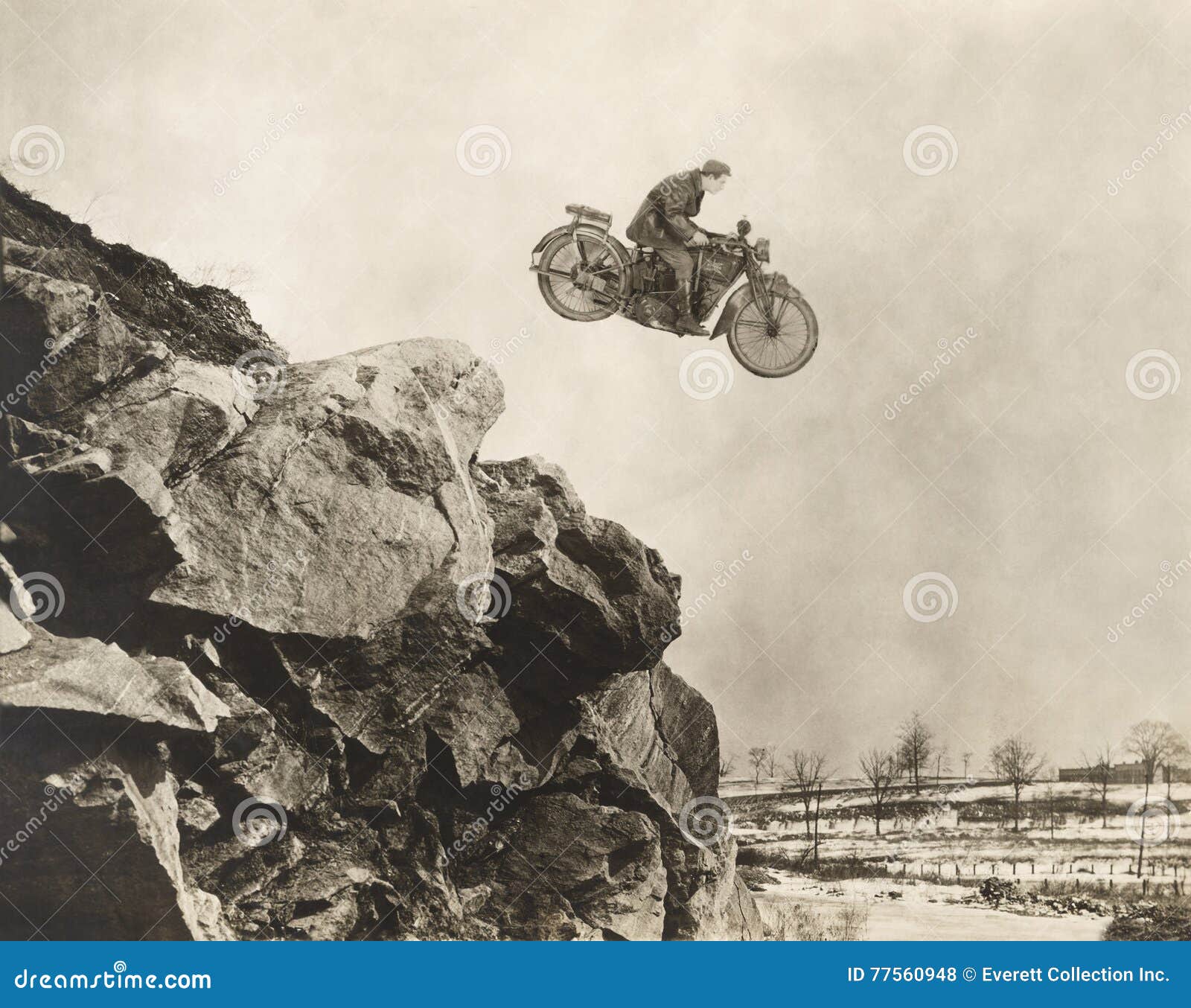 Stuntman on Motorbike Flying Over Cliff Stock Photo - Image of looking ...