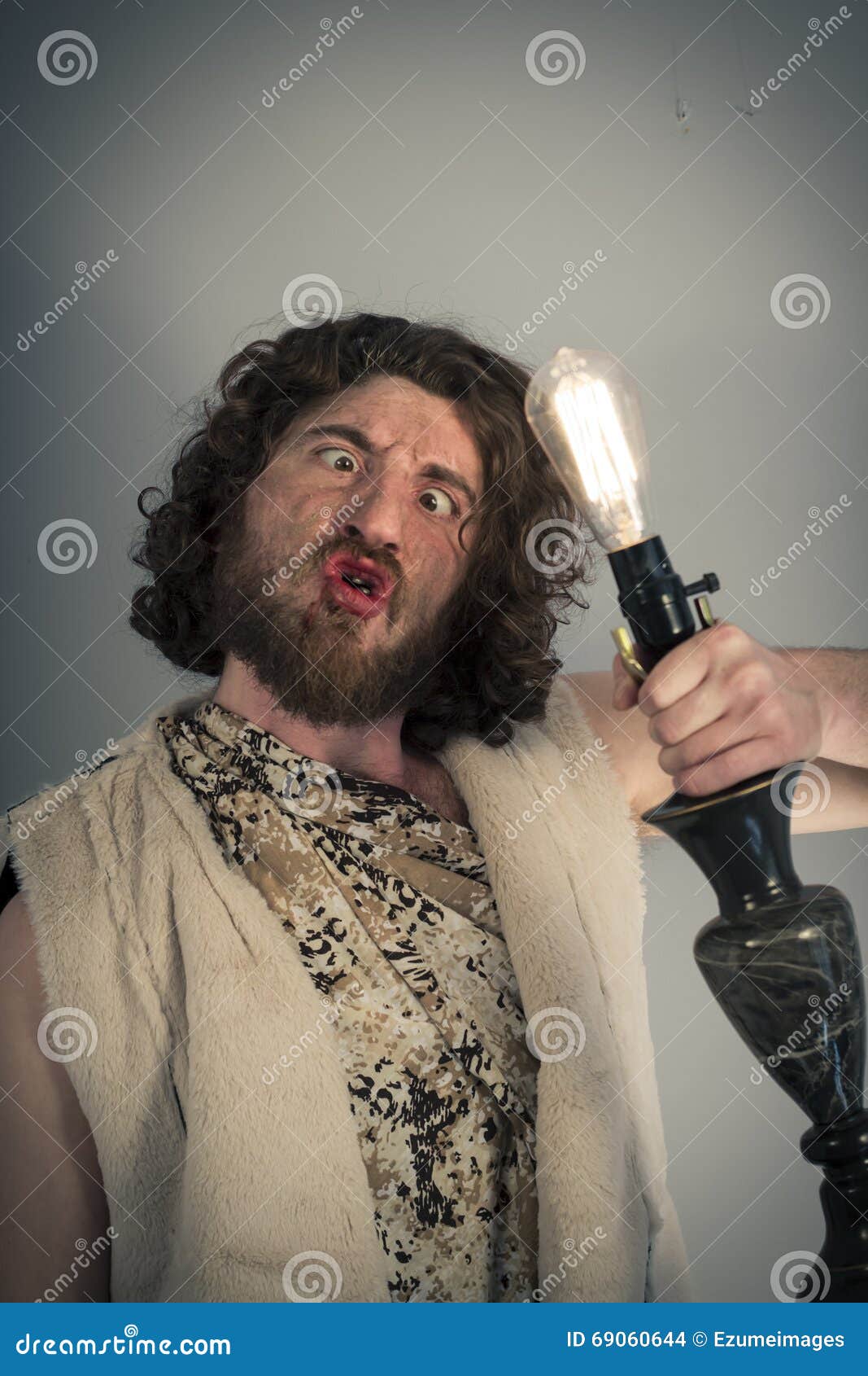 Stupid Caveman Lightbulb stock photo. Image of prehistoric - 69060644