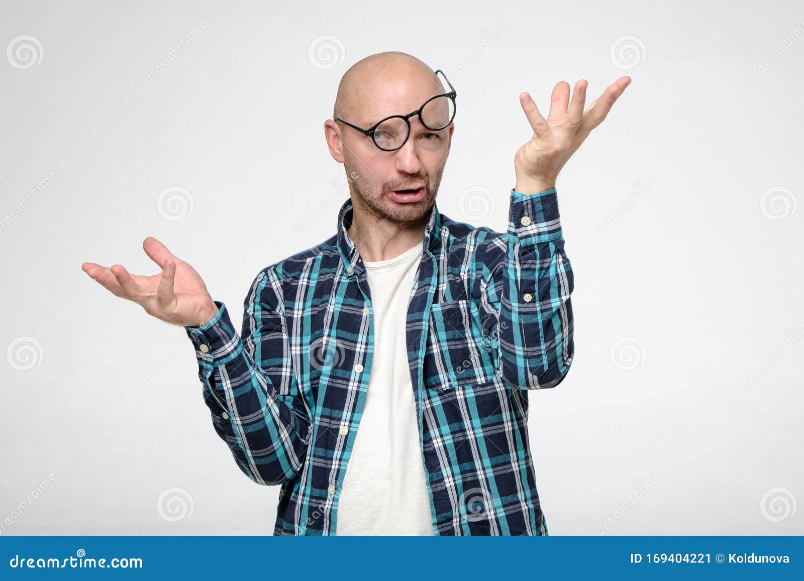 Stupid Looking Bald Man with a Grimace on Face, Wearing Slanting ... Stupid Looking Bald Man with a Grimace on Face, Wearing Slanting ...