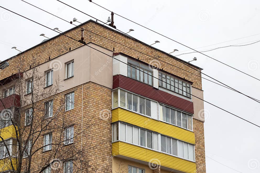 A Sturdy Brick Building Featuring a Balcony Adorning Its Top Section ...
