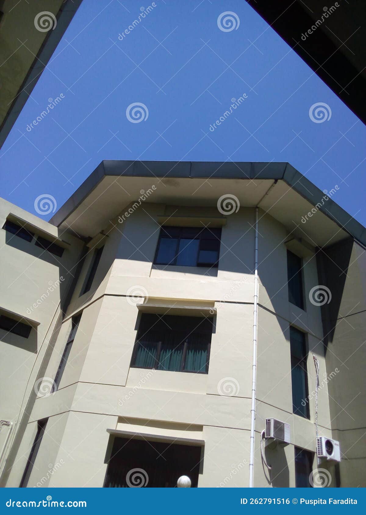 A Sturdy Building Under a Blue Sky Stock Photo - Image of roof ...