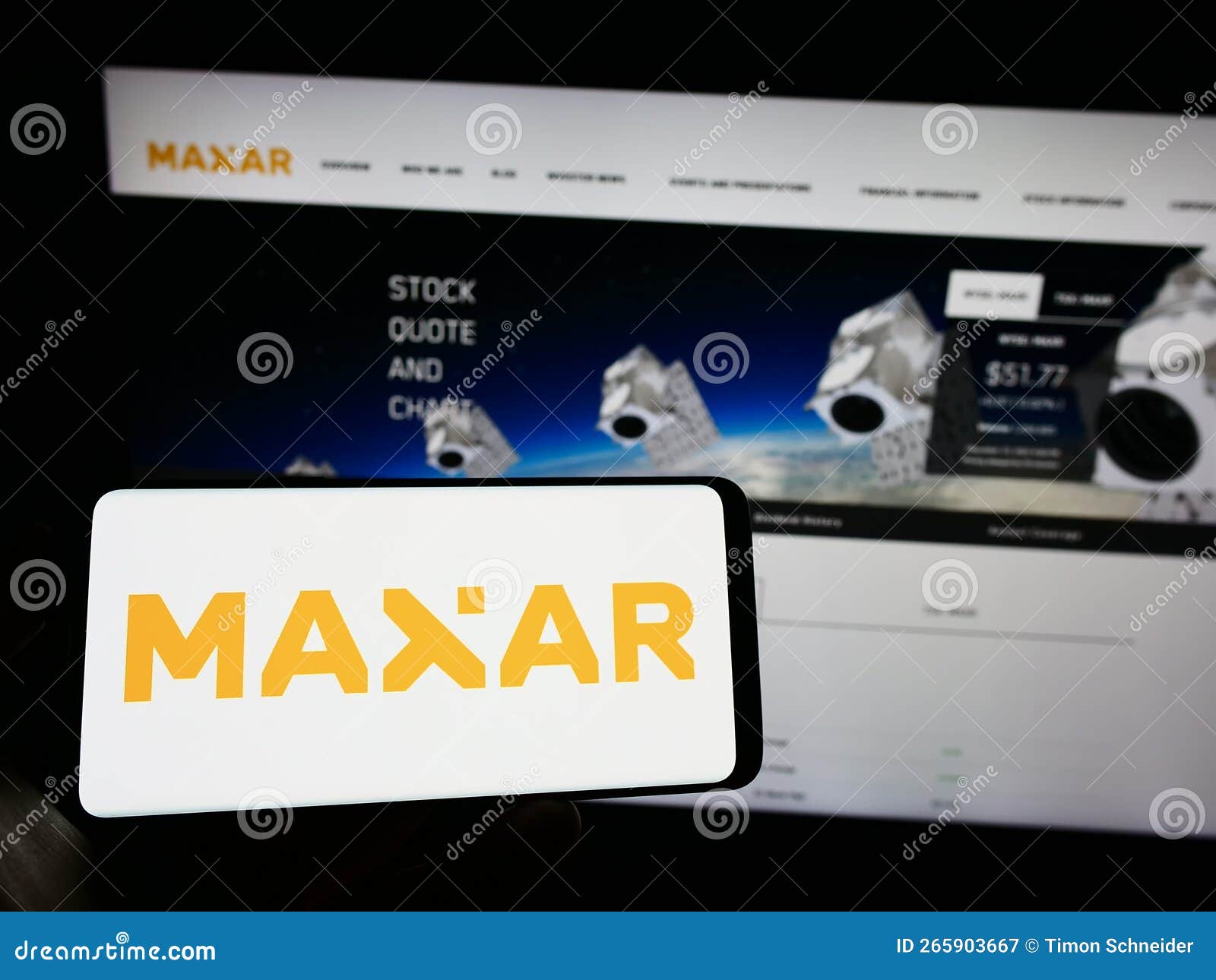 Person Holding Mobile Phone With Logo Of American Space Company Maxar Technologies Inc On
