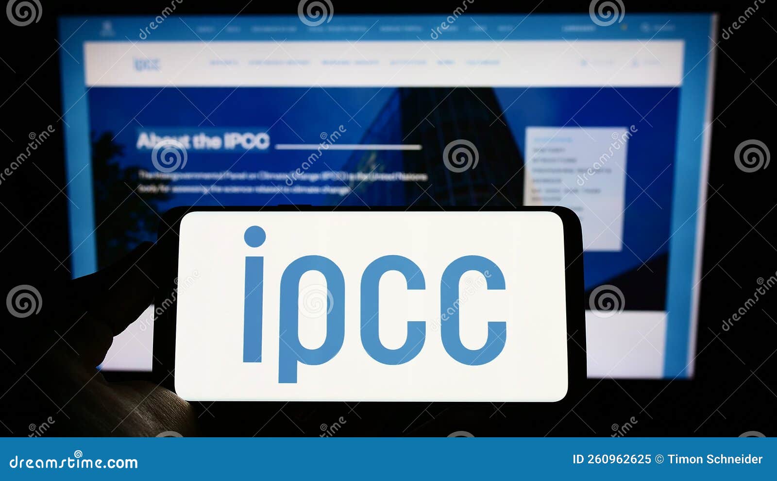Person Holding Mobile Phone with Logo of Intergovernmental Panel on ...