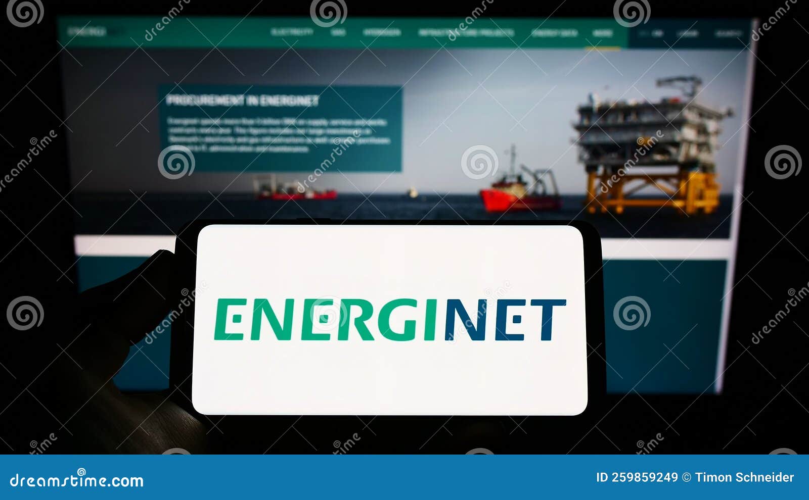 Person Holding Smartphone with Logo of Danish Transmission System ...