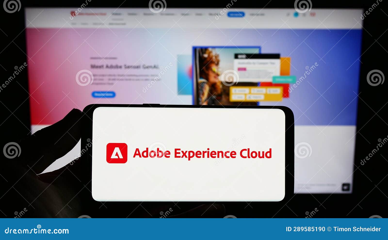 Person Holding Smartphone with Logo of Software Product Adobe ...