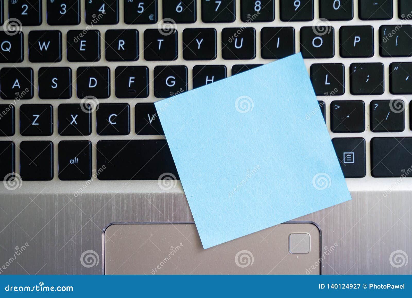Style Image of Modern Laptop Computer Keyboard. Blue Sticky Note To the ...