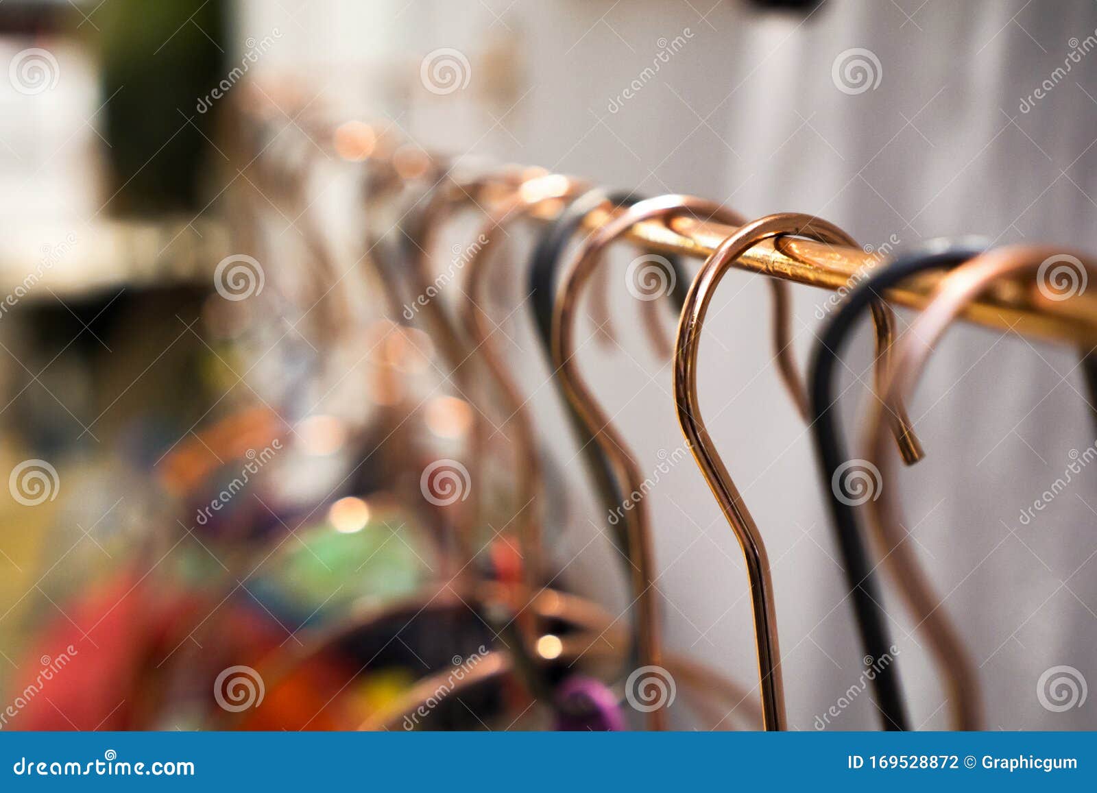 Styled Modern Coat Hooks with Colorful Hanging Clothing Stock Photo ...
