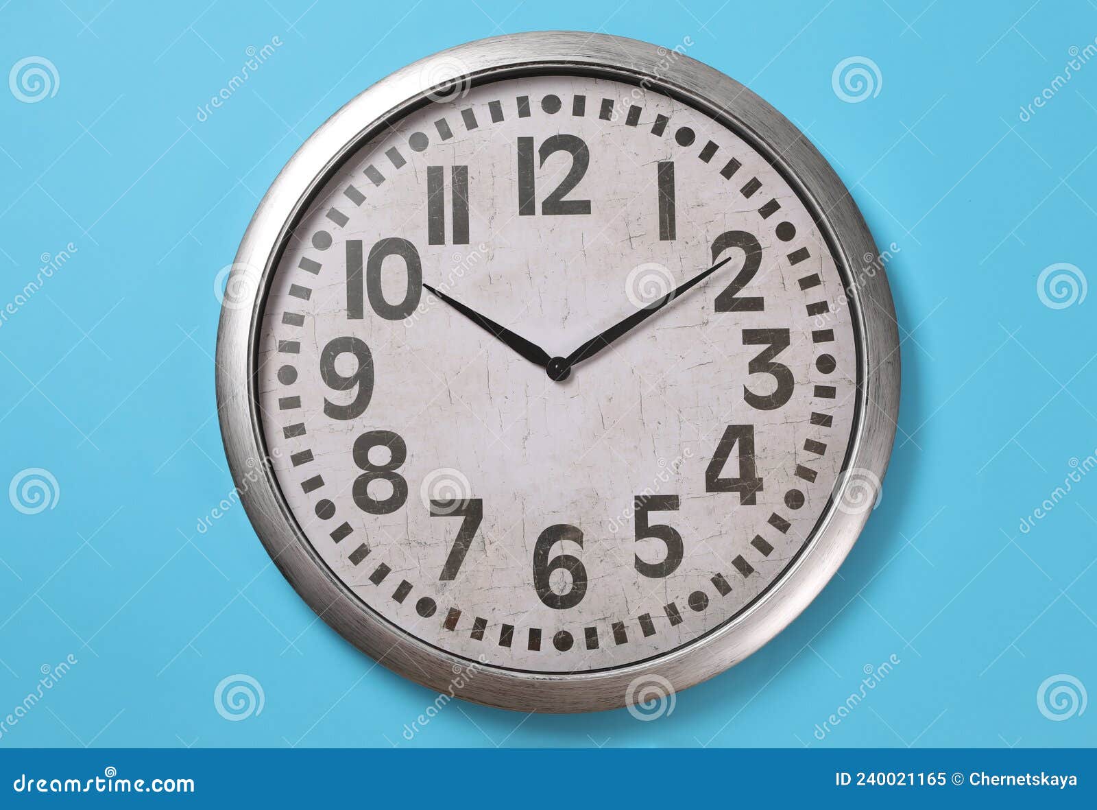Stylish Analog Clock Hanging on Light Blue Wall Stock Image - Image of ...