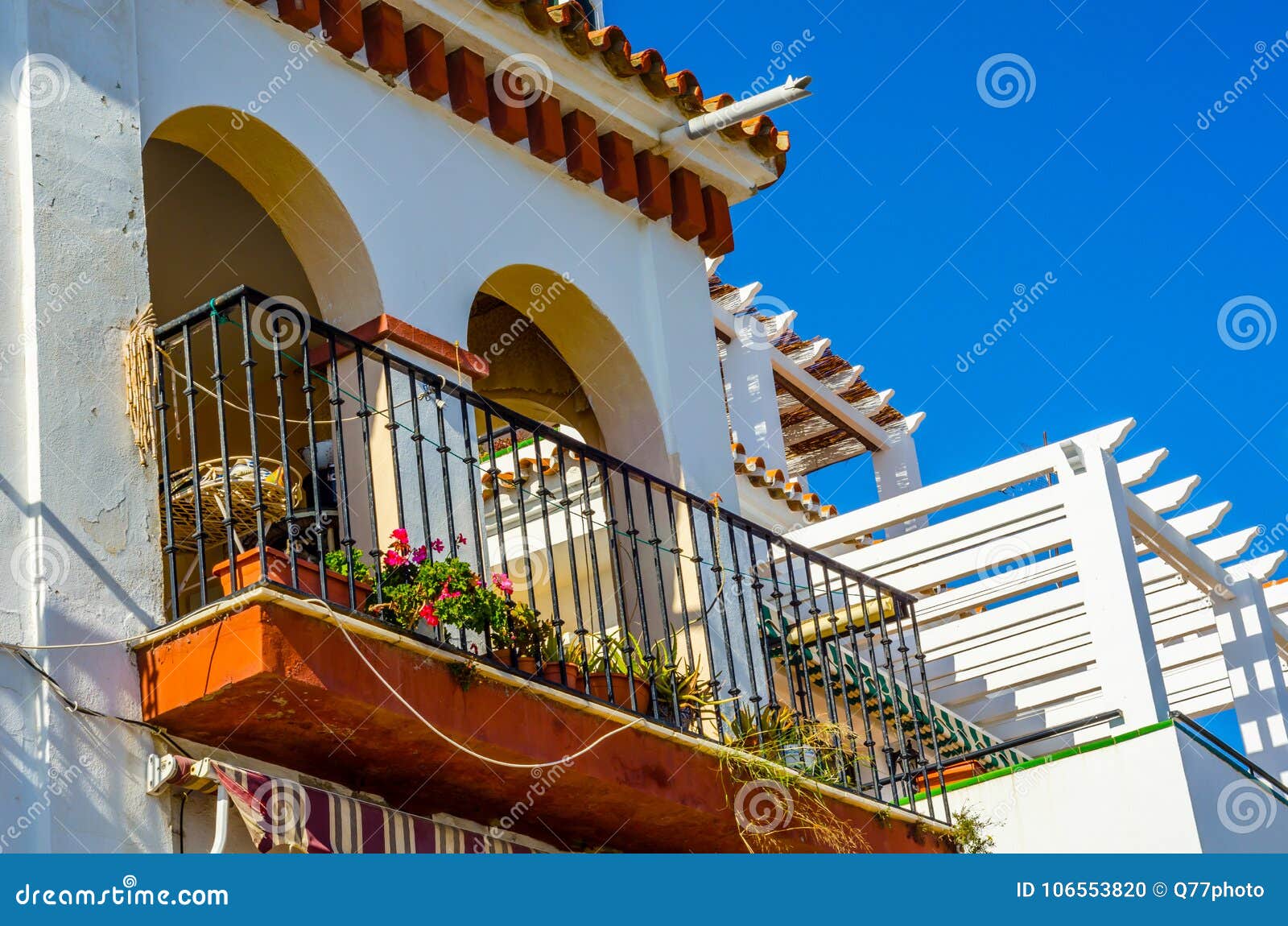 Stylish Balcony with a Metal Railing, Solid Architectural Element, a ...