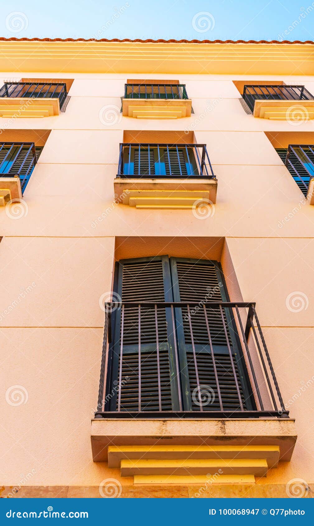 Stylish Balcony with a Metal Railing, Solid Architectural Element, a ...