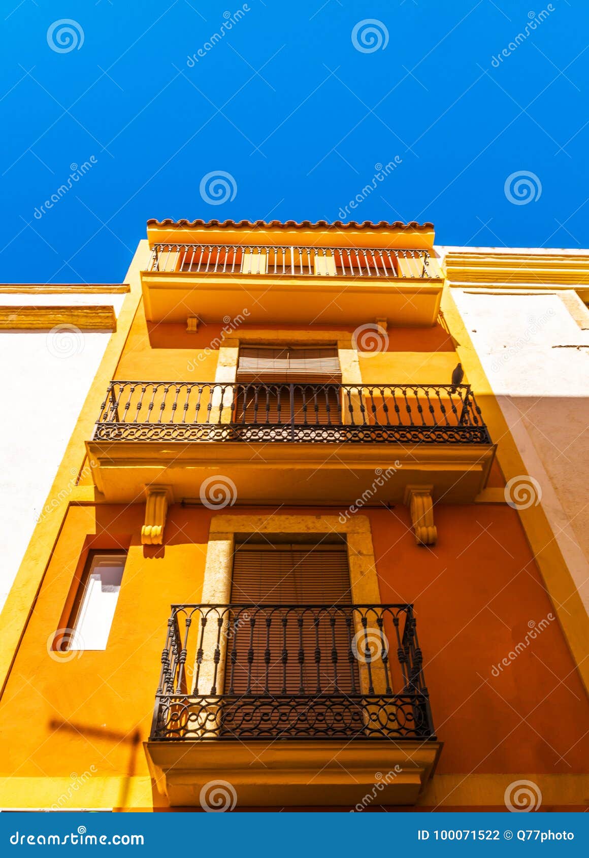 Stylish Balcony with a Metal Railing, Solid Architectural Element, a ...