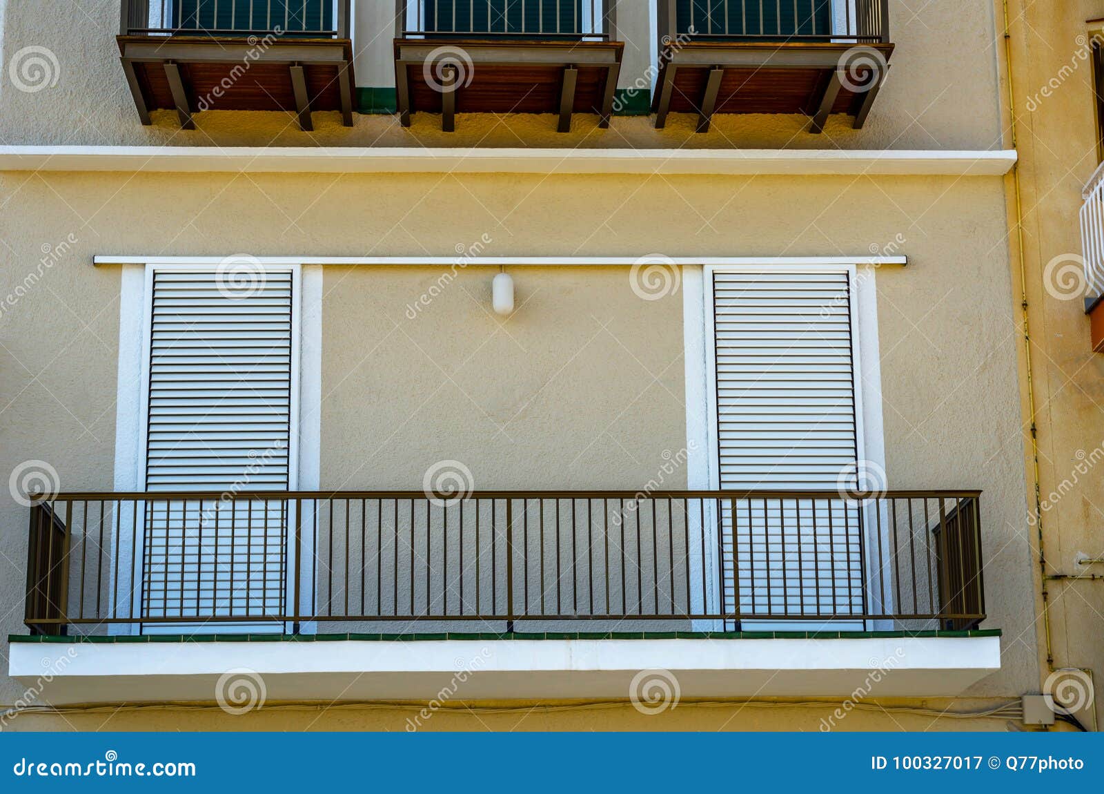 Stylish Balcony with a Metal Railing, Solid Architectural Element, a ...