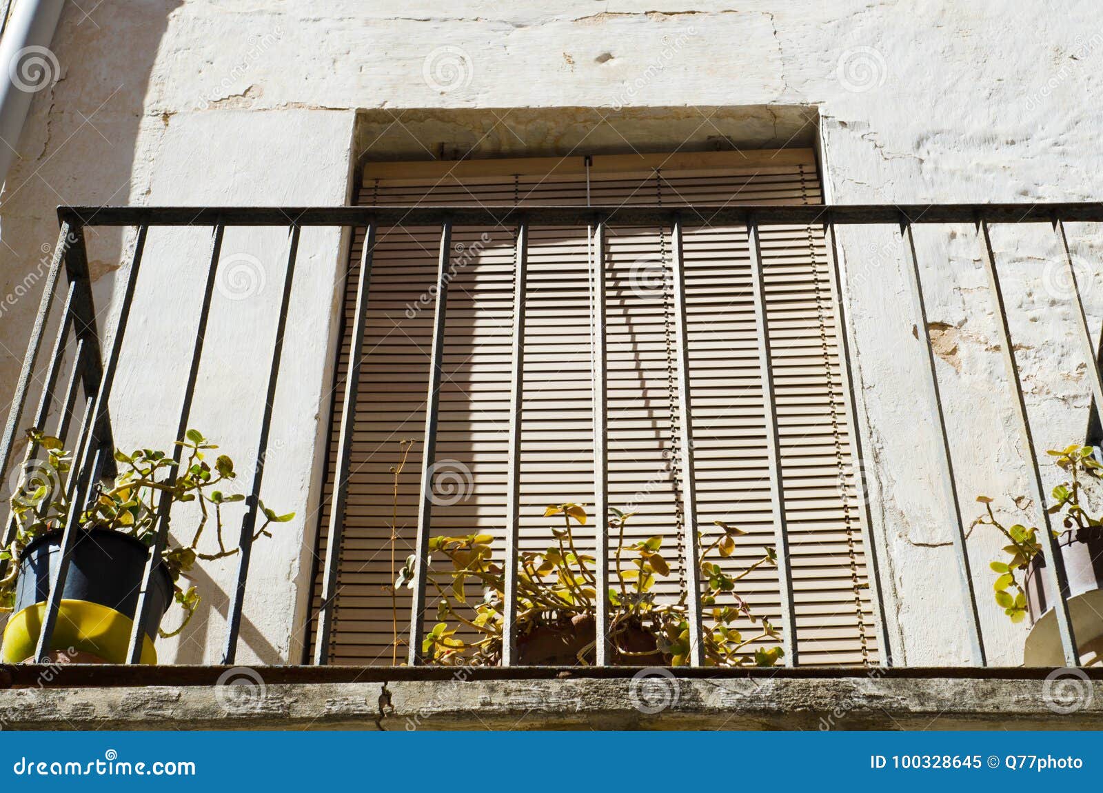 Stylish Balcony with a Metal Railing, Solid Architectural Element, a ...