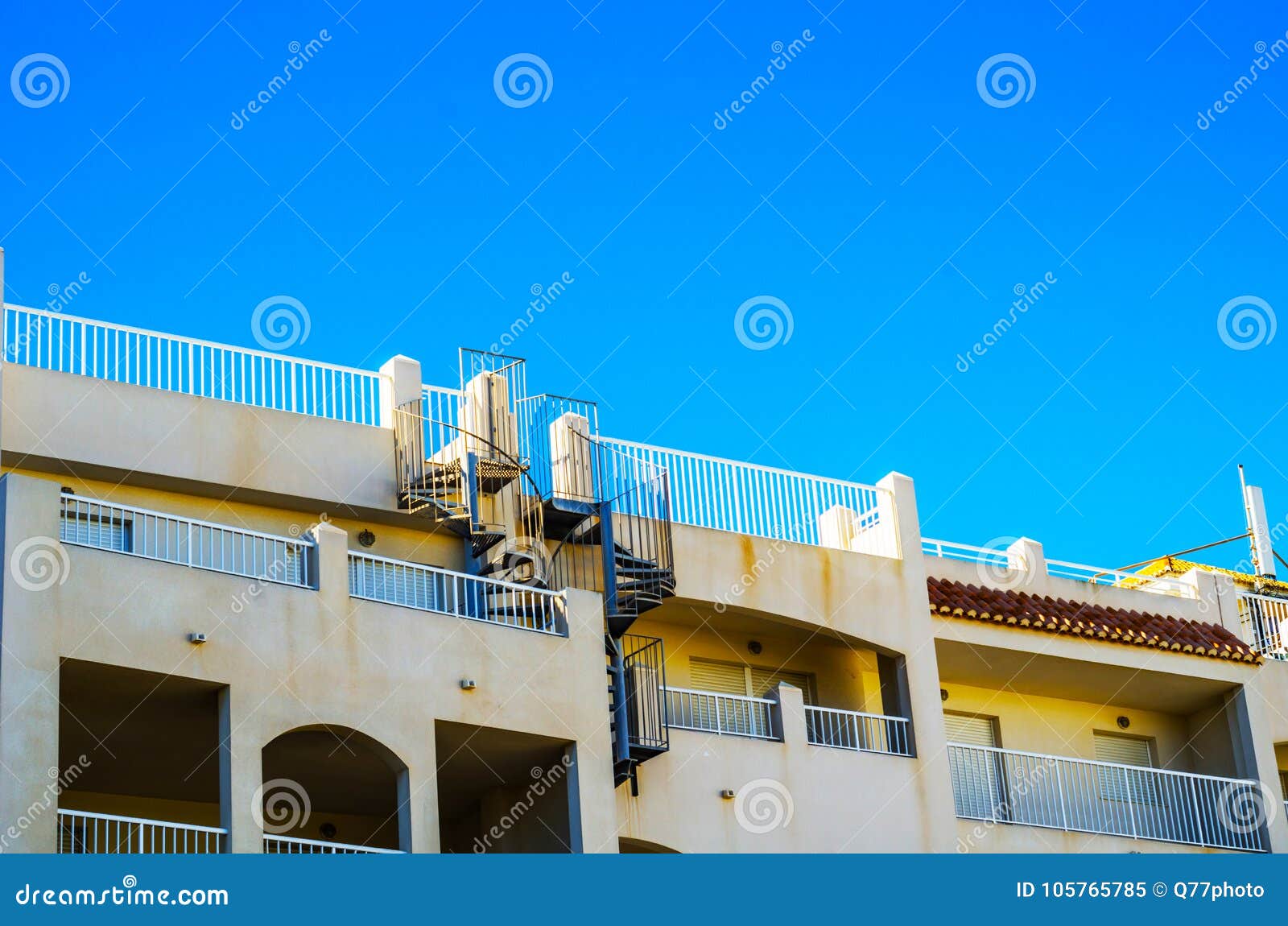 Stylish Balcony with a Metal Railing, Solid Architectural Element, a ...