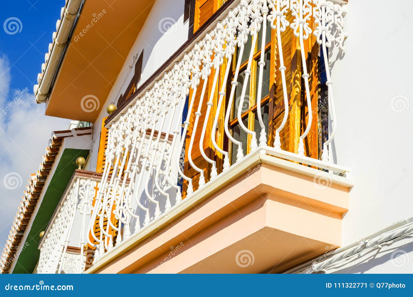 Stylish Balcony with a Metal Railing, Solid Architectural Element, a ...