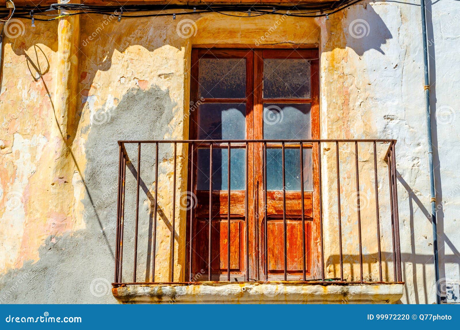 Stylish Balcony with a Metal Railing, Solid Architectural Element, a ...