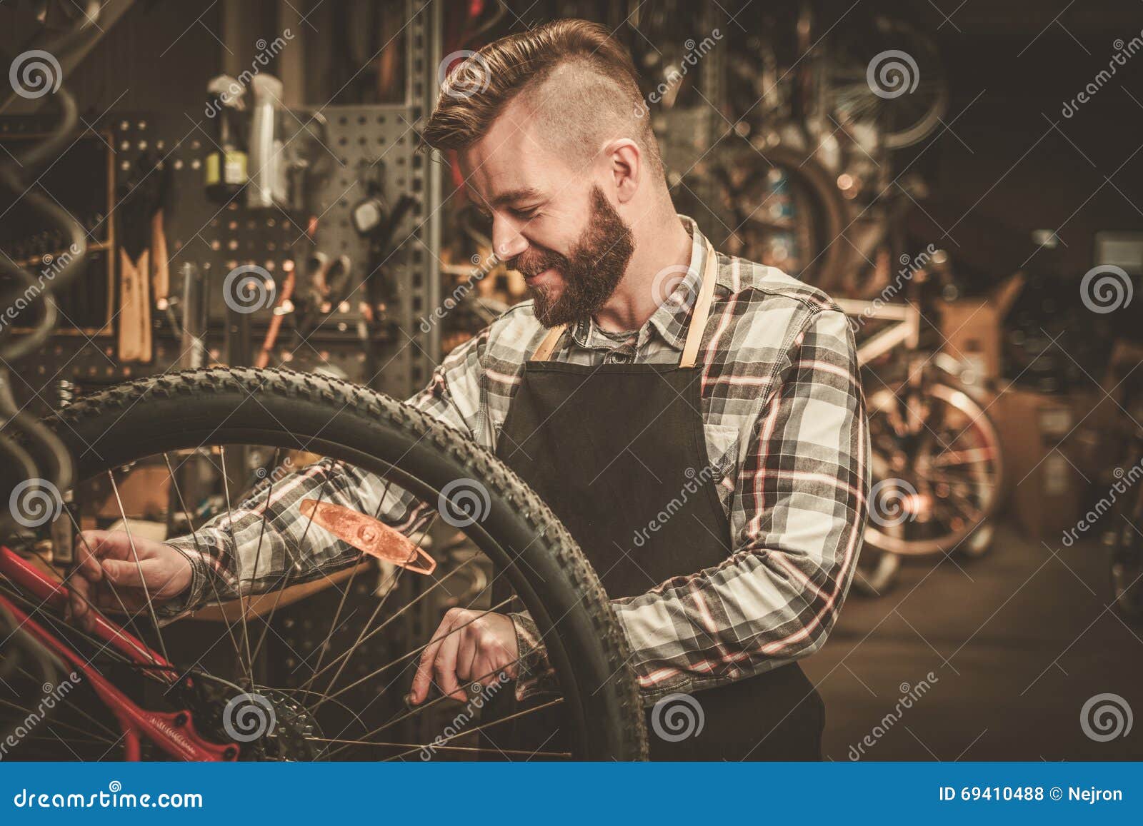 Stylish Bicycle Mechanic Doing His Professional Work in Workshop Stock ...
