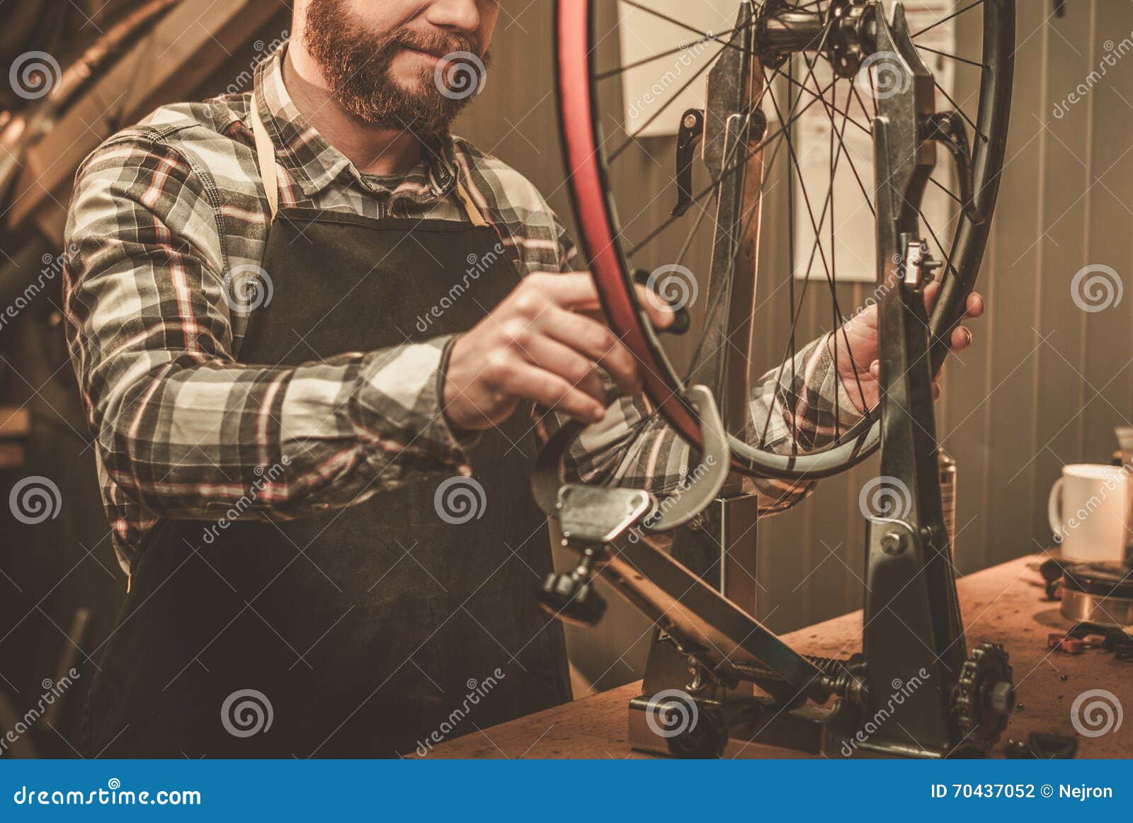Stylish Bicycle Mechanic Doing His Professional Work in Workshop. Stock ...