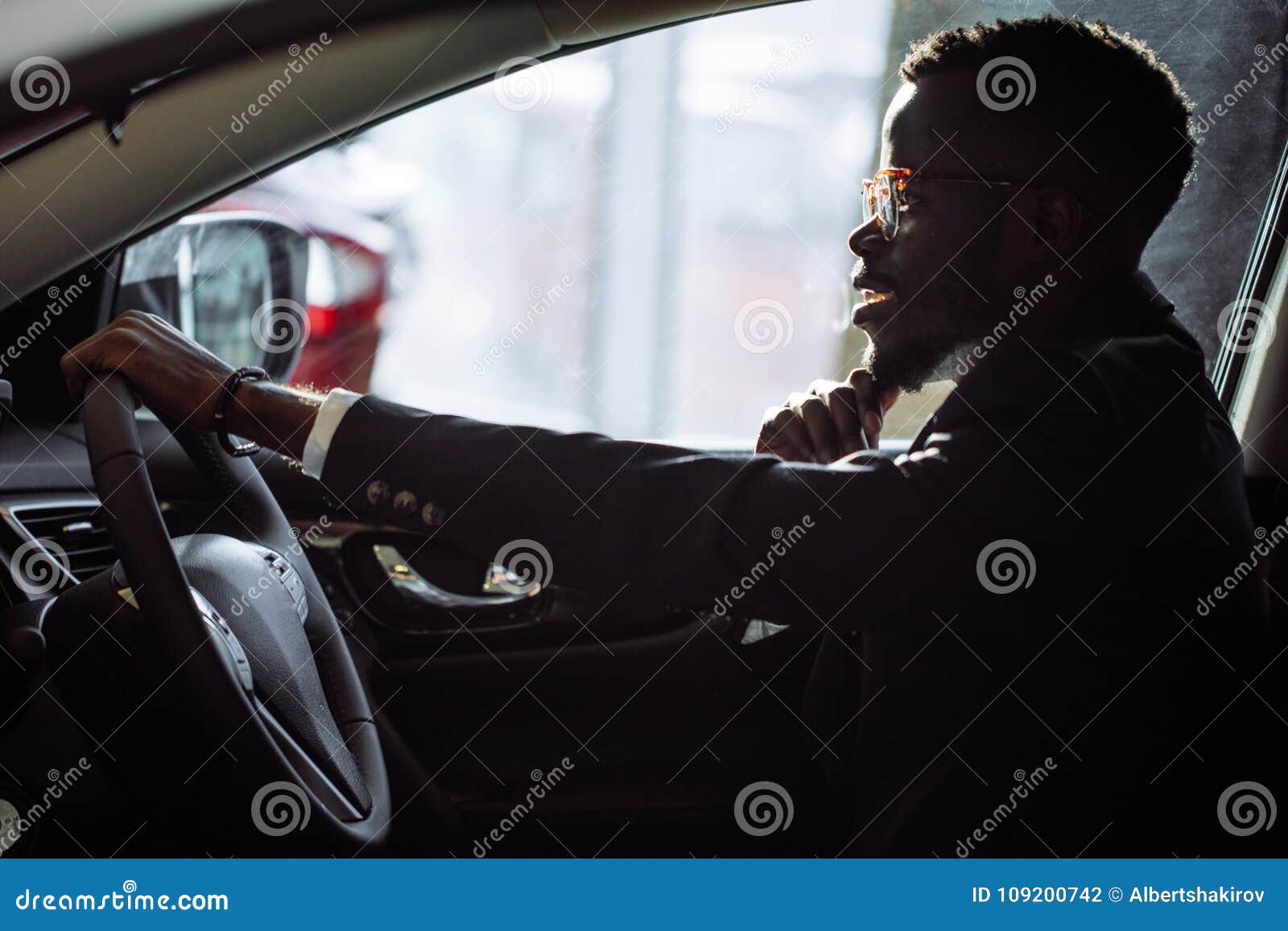 Stylish black man in car stock photo. Image of black - 109200742