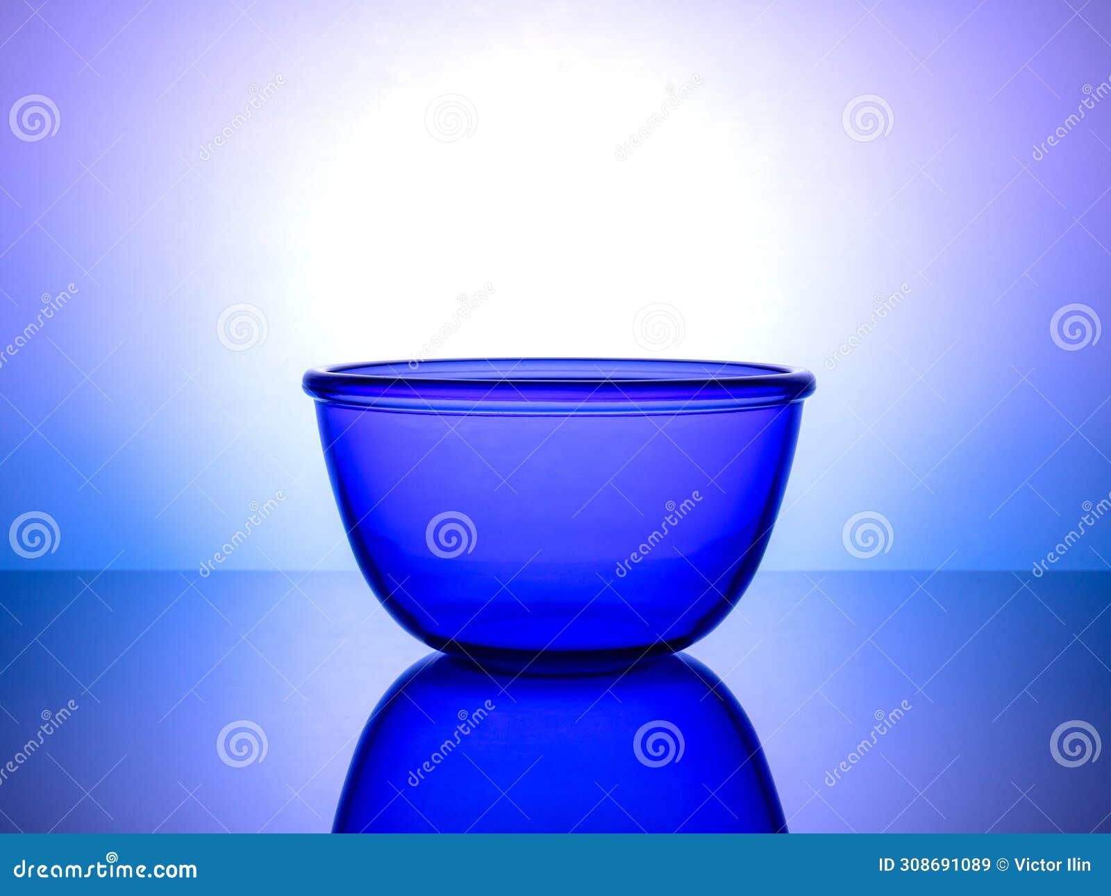 Stylish Blue Glass Dinnerware on Glowing Gradient Background for Chic ...