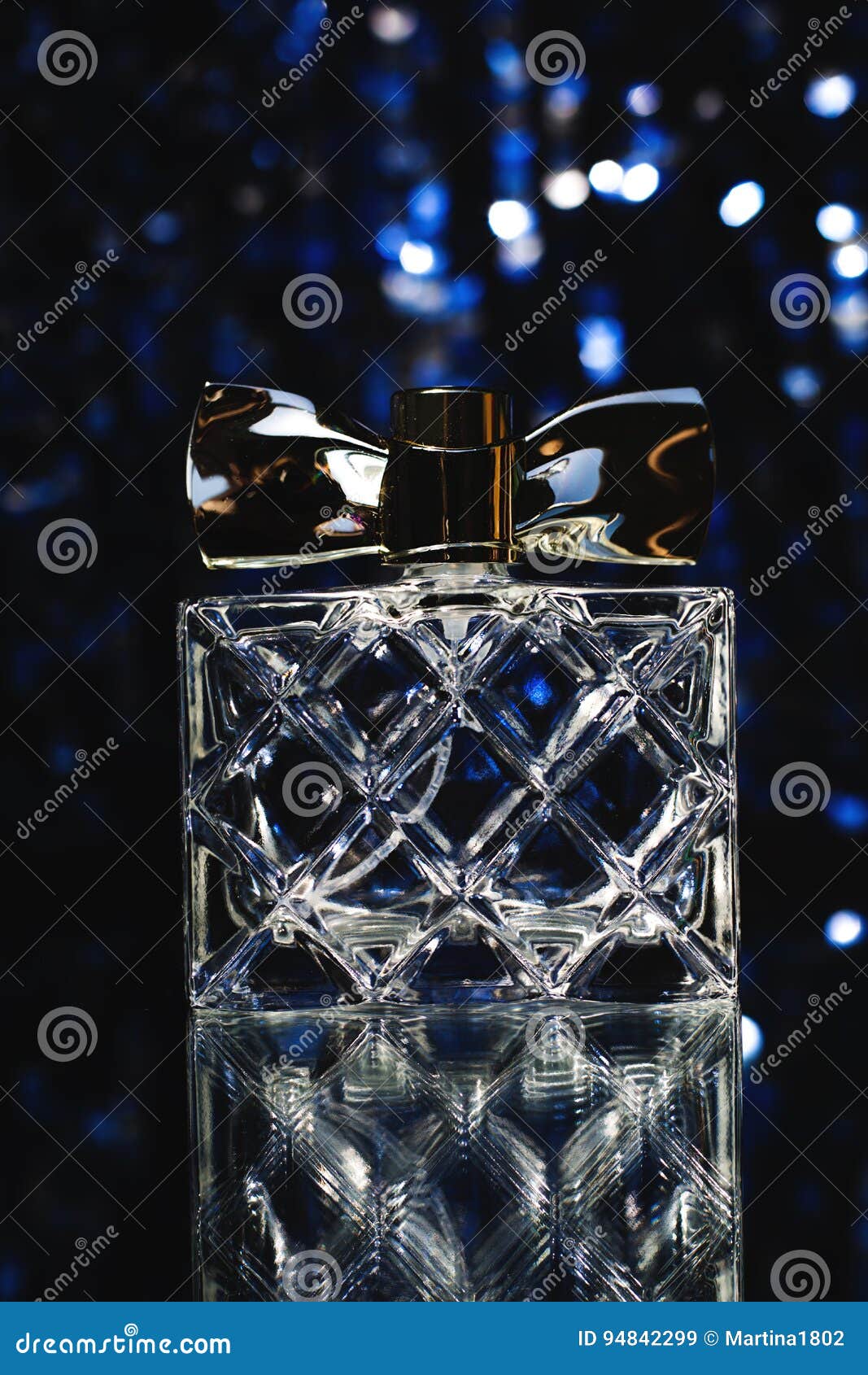 Stylish Bottle of Female Perfume Over Blue Stock Image - Image of ...