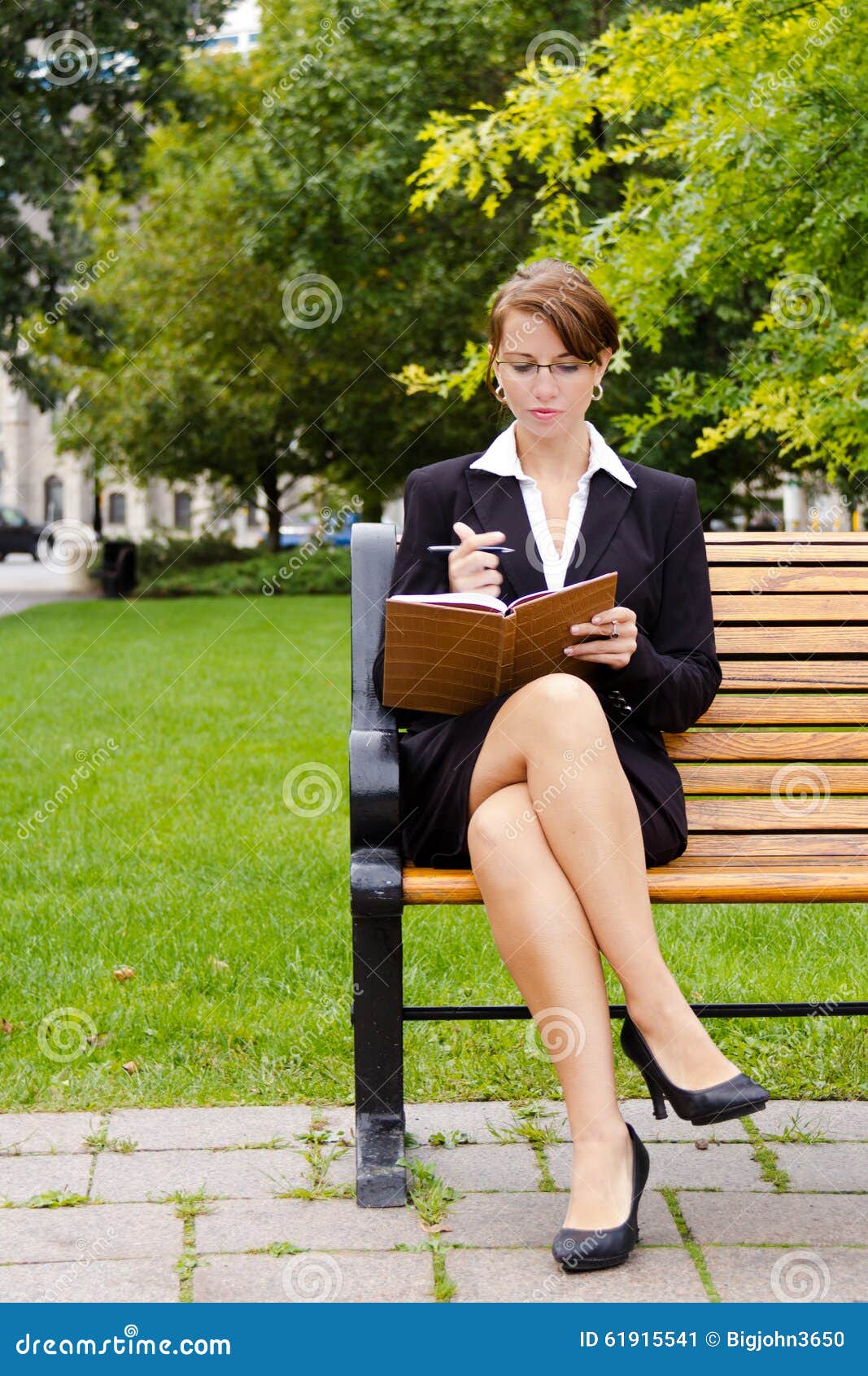 Stylish Business Woman Siting on Park Bench Writing in Notebook Stock ...