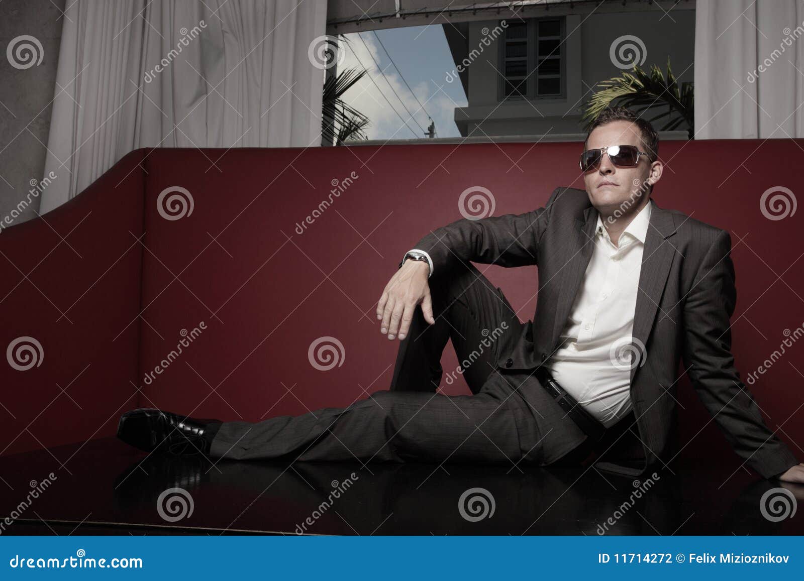 Stylish Businessman on a Table Stock Photo - Image of caucasian, style ...