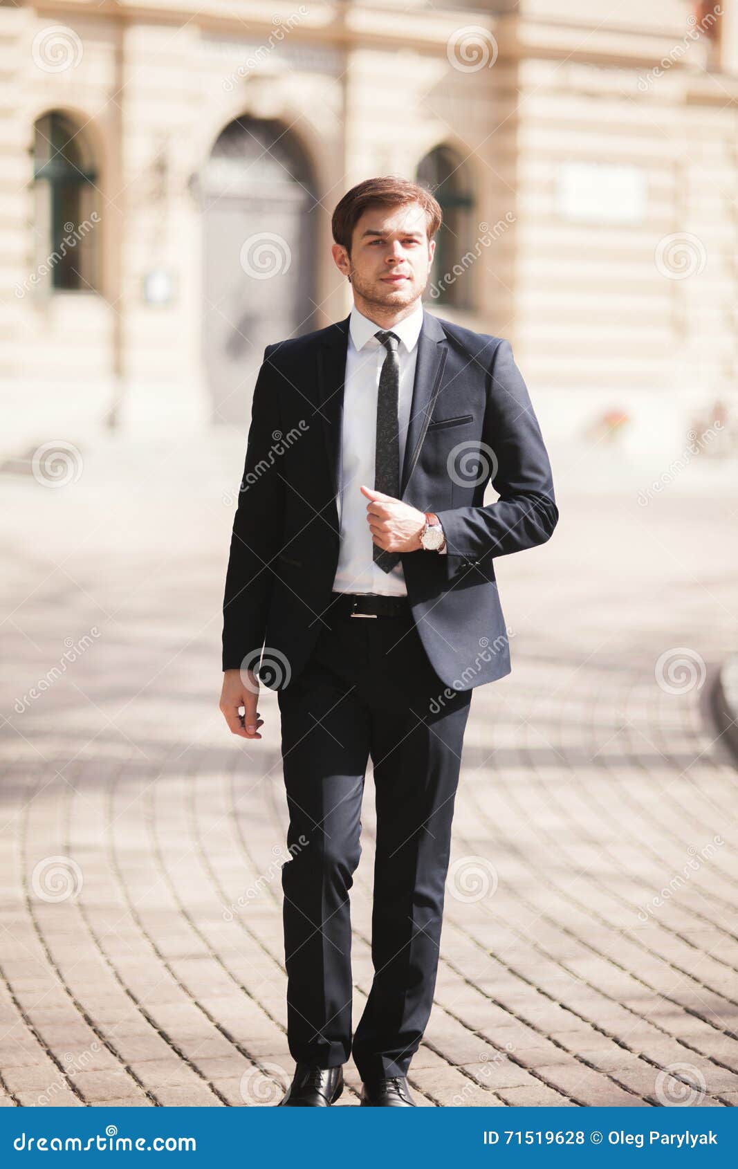 Stylish Businessman Walking Outdoors and Looking Away Stock Photo ...