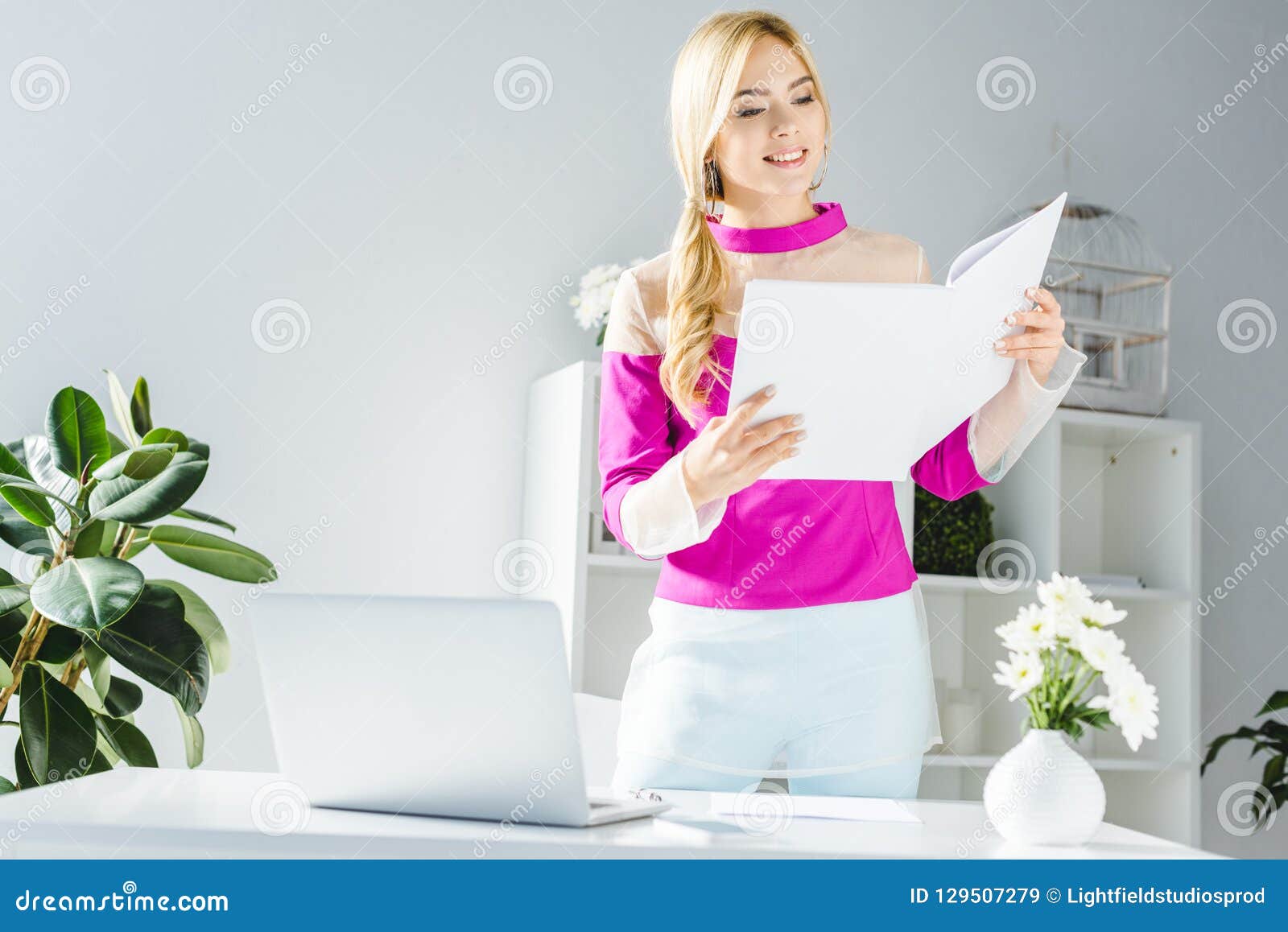 Stylish Businesswoman Working with Documents and Laptop Stock Image ... Stylish Businesswoman Working with Documents and Laptop Stock Image ...