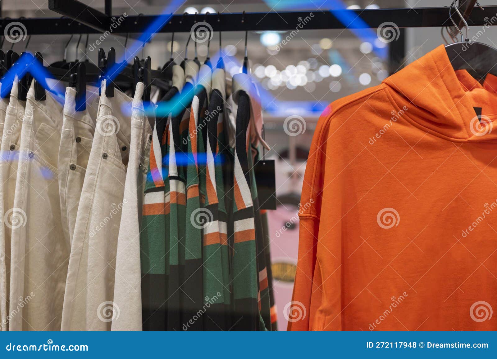 Stylish Clothes Hang on Hangers in a Store Stock Photo - Image of dress ...