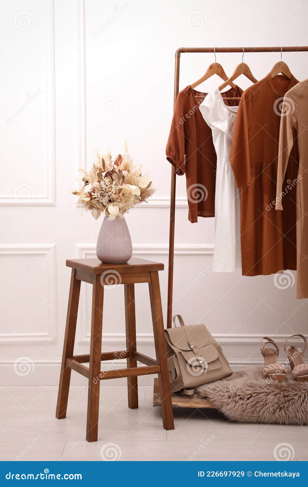Stylish Clothes Hanging on Rack in Dressing Room. Interior Design ...