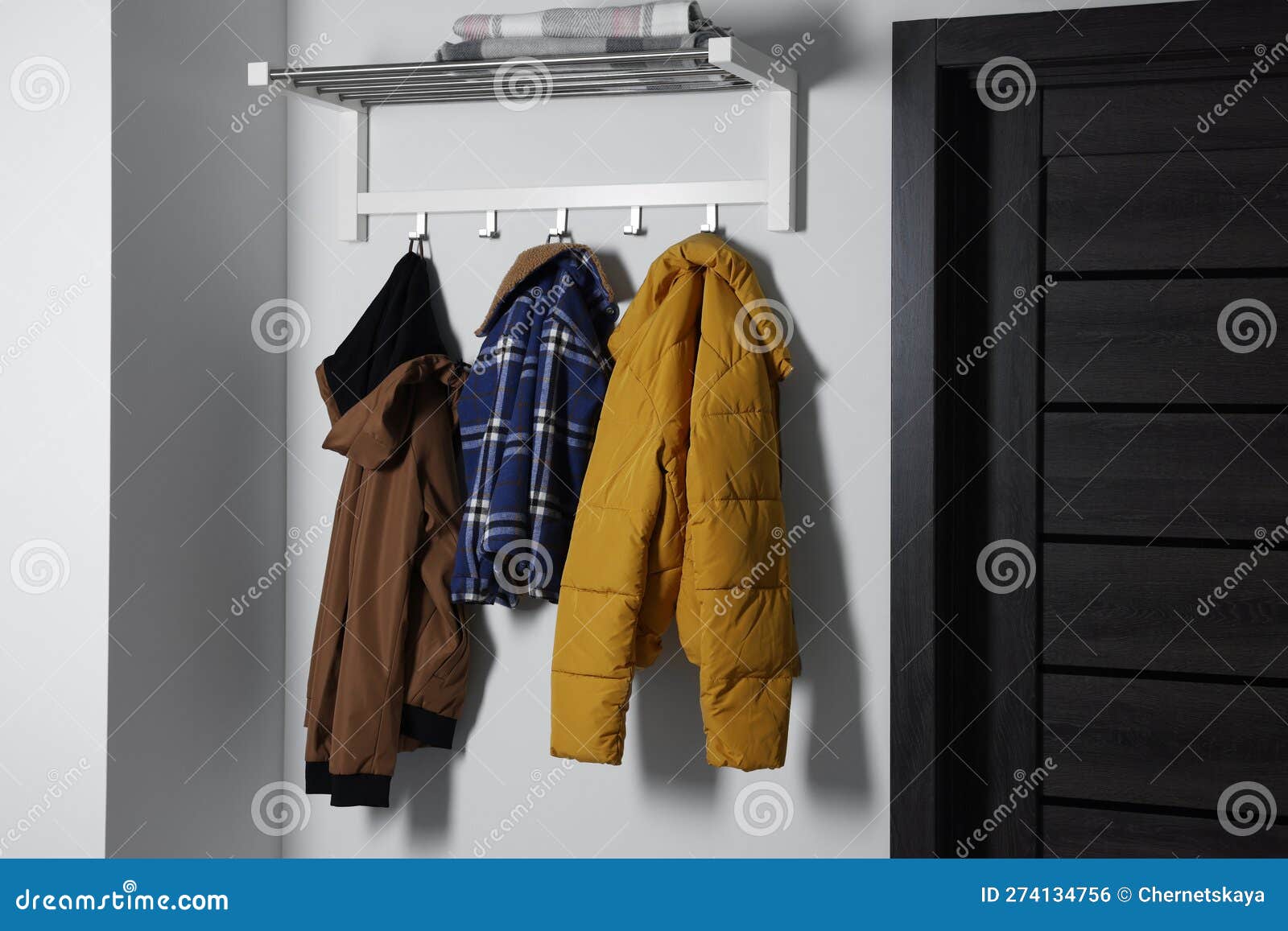 Stylish Coat Rack on White Wall in Hallway. Interior Design Stock Photo ...