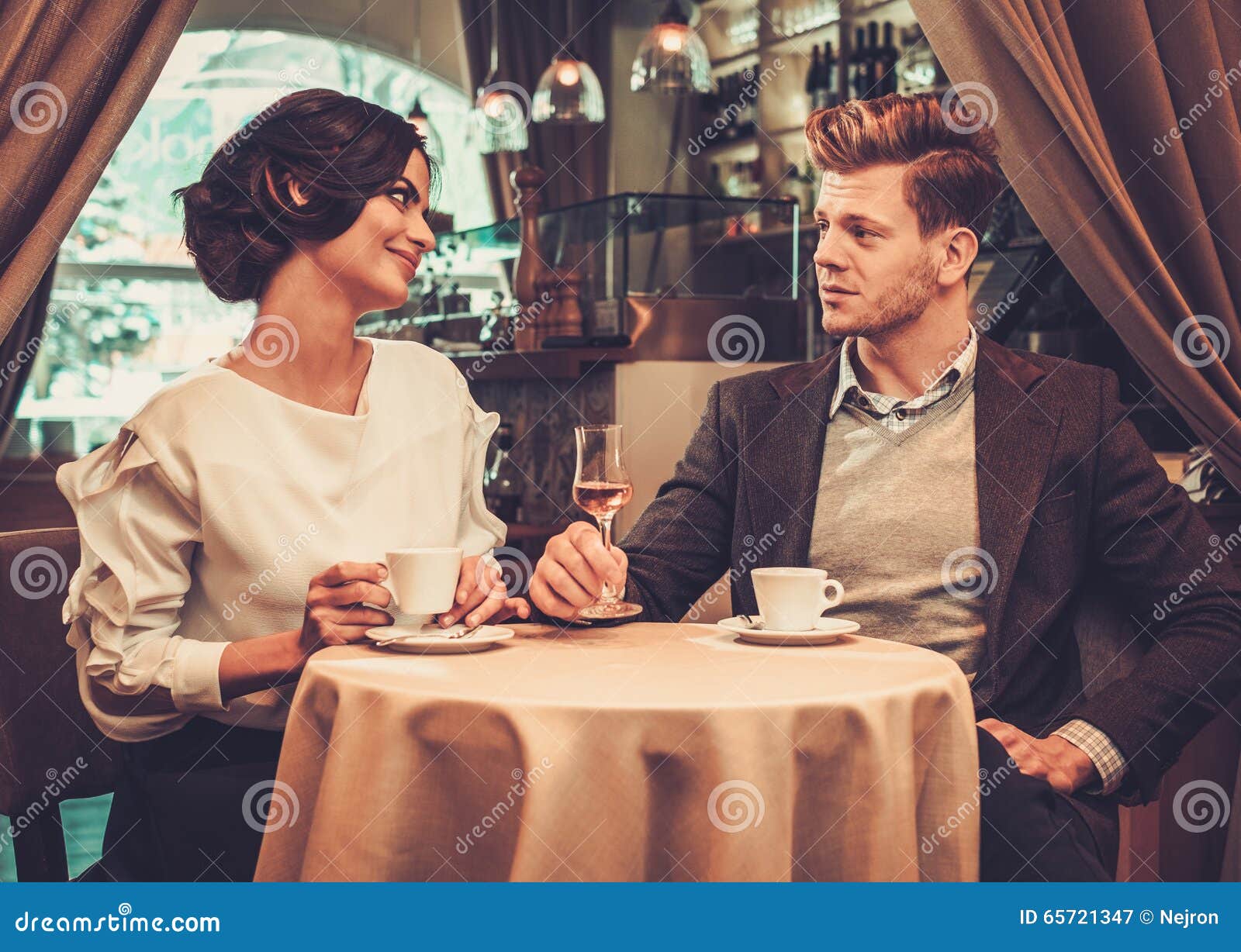 Stylish Couple Drinking Coffee in Restaurant. Stock Image - Image of ...