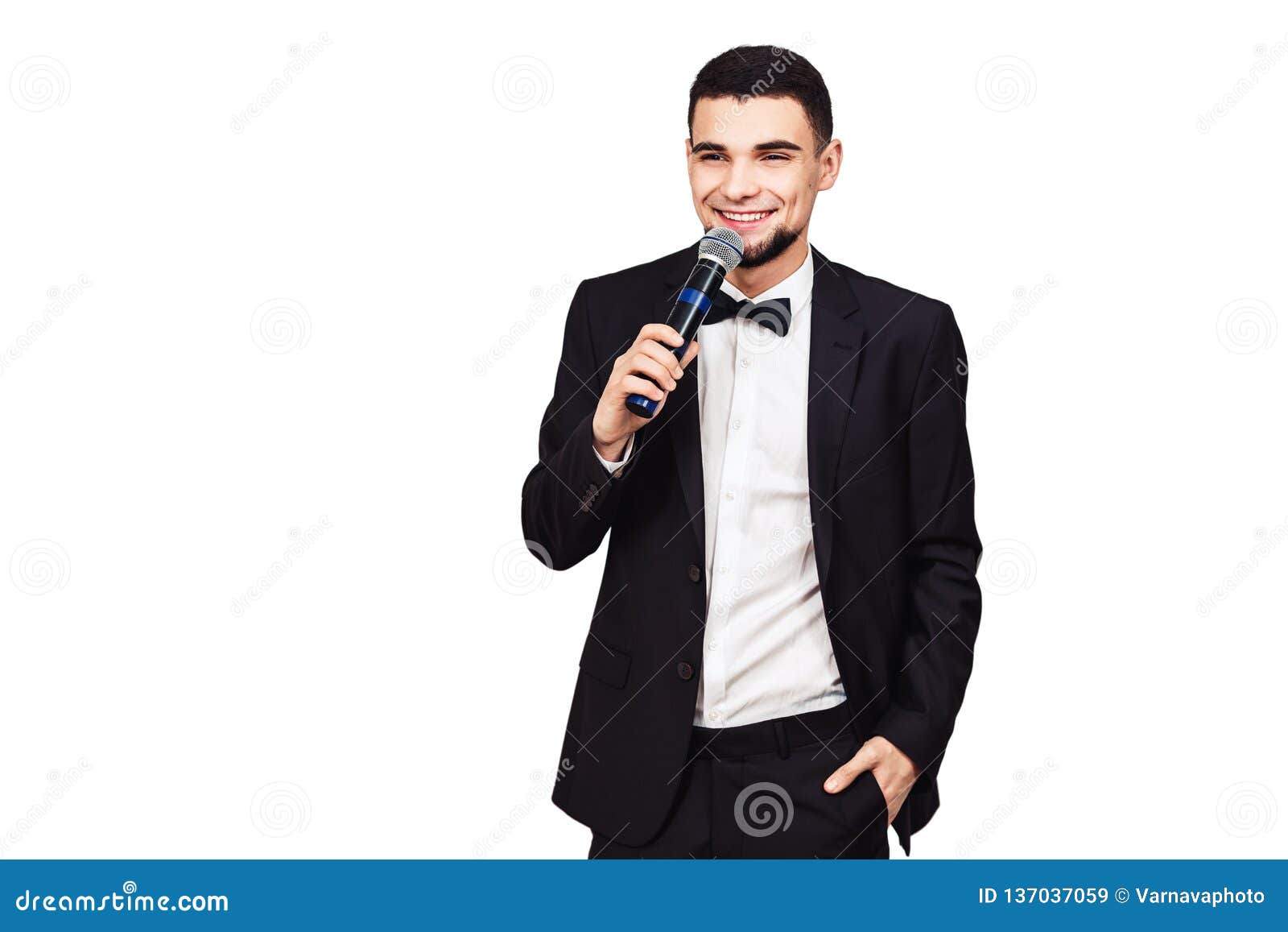 Stylish Elegant Man In A Black Suit With A Microphone In His Hand Stock