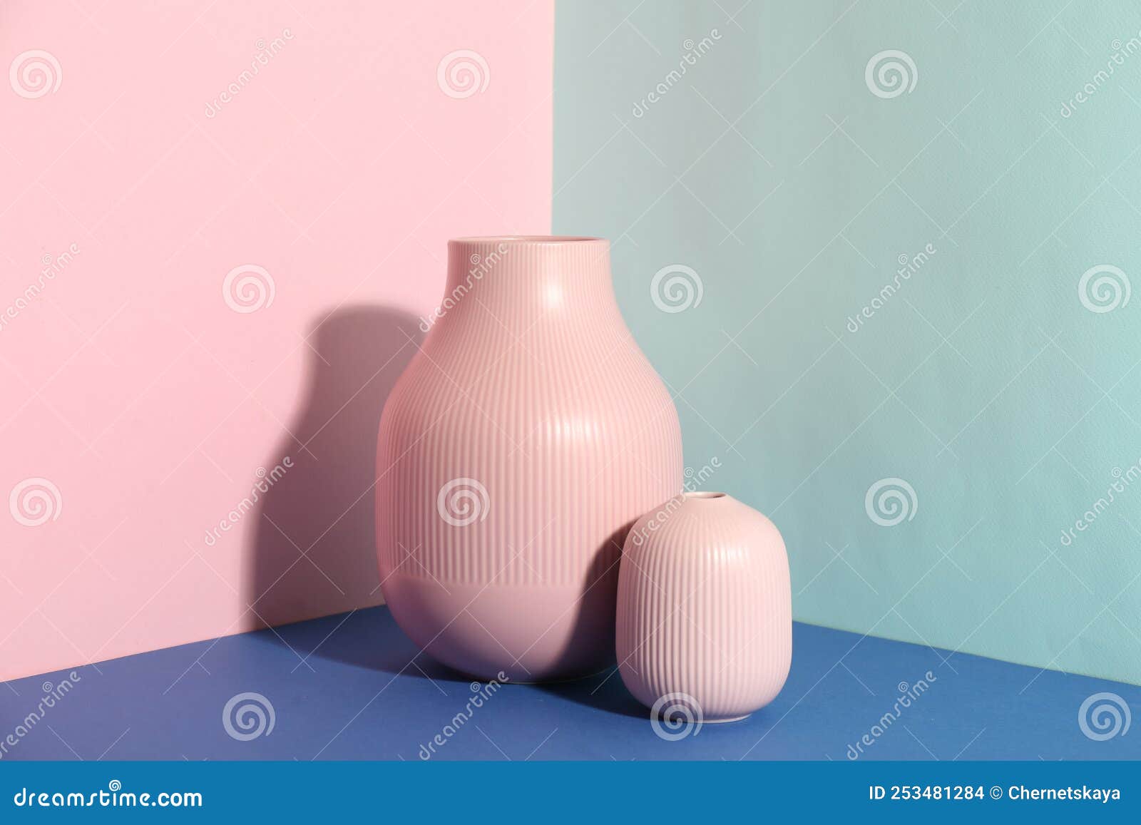 Stylish Empty Ceramic Vases on Color Background Stock Photo - Image of ...