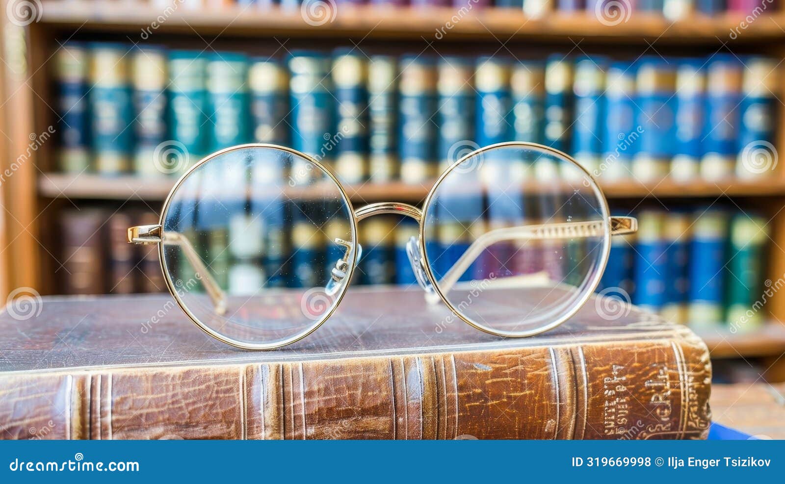 Stylish Eyeglasses Next To a Book with a Bookcase in the Background ...