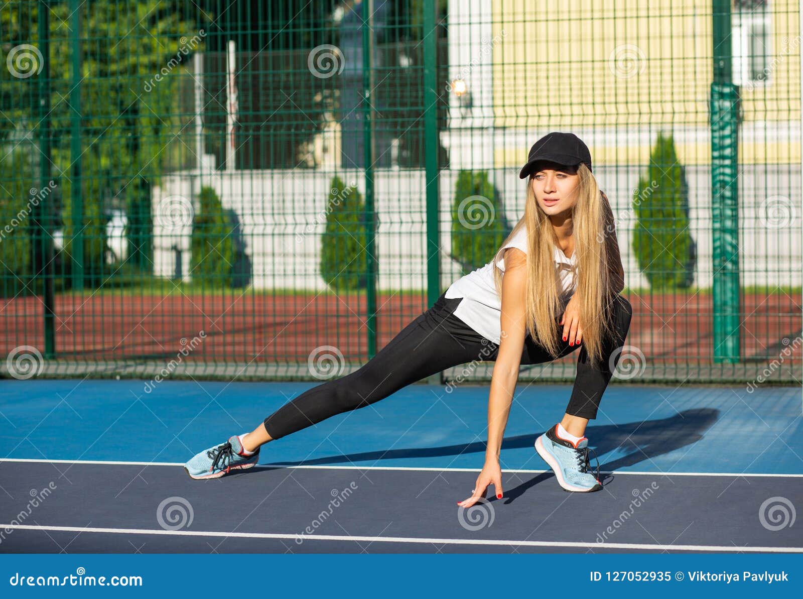 Stylish Fit Blonde Girl Doing Stretching Before Workout At The T Stock