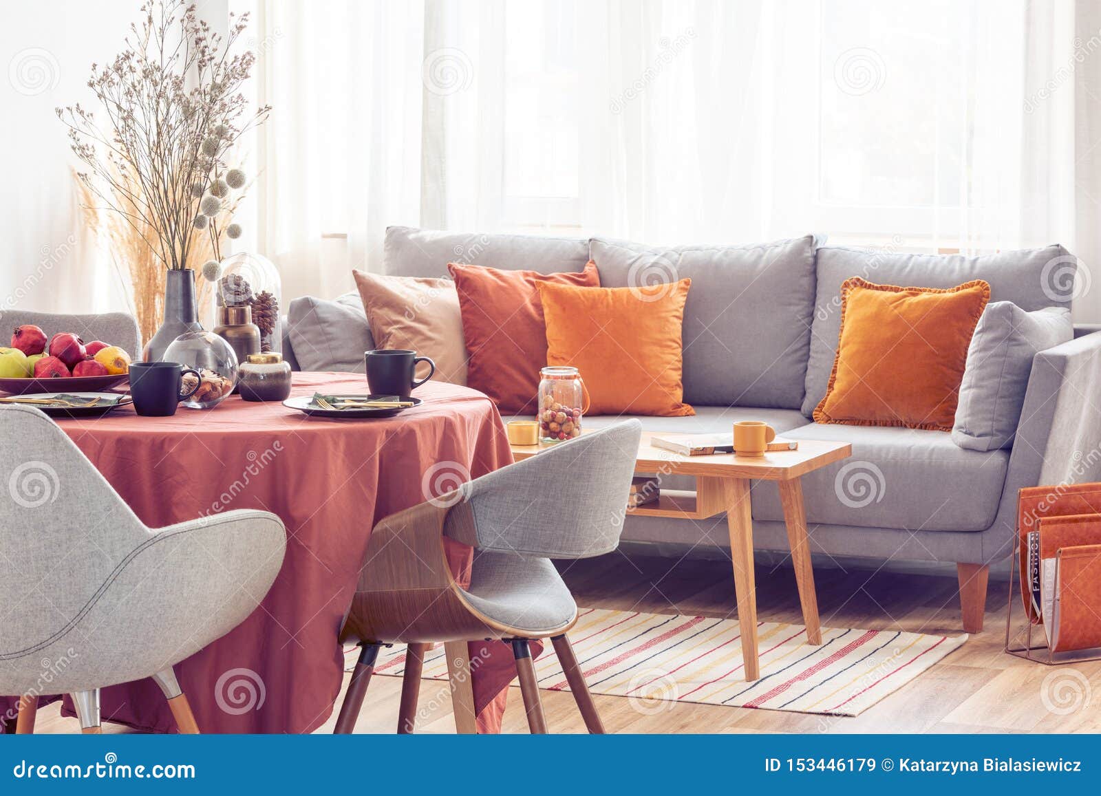 Stylish Grey Chairs at Dining Table Covered with Long Tablecloth Stock ...