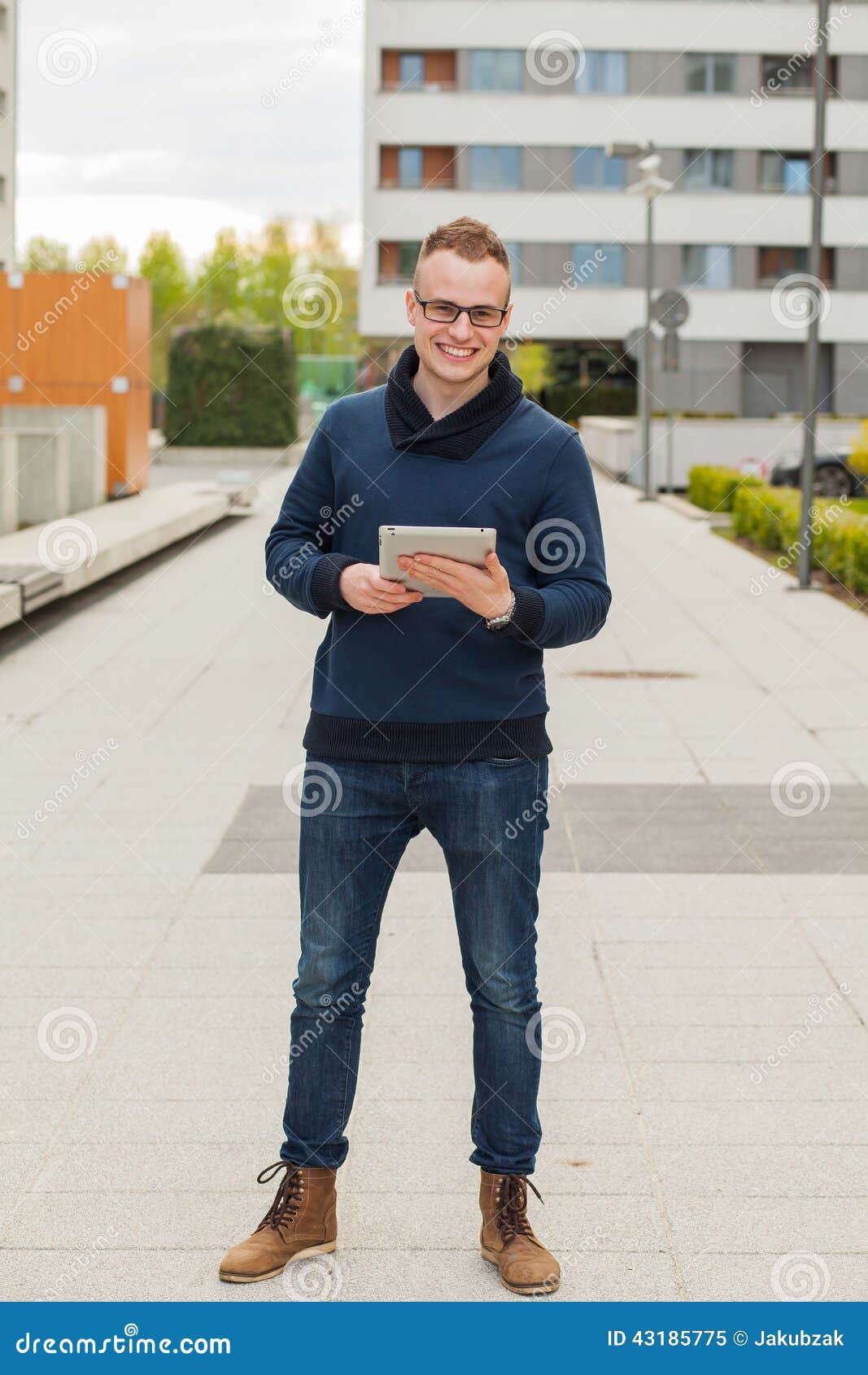 Stylish Guy Connected on Internet with Tablet in Town. he is Hap Stock ...