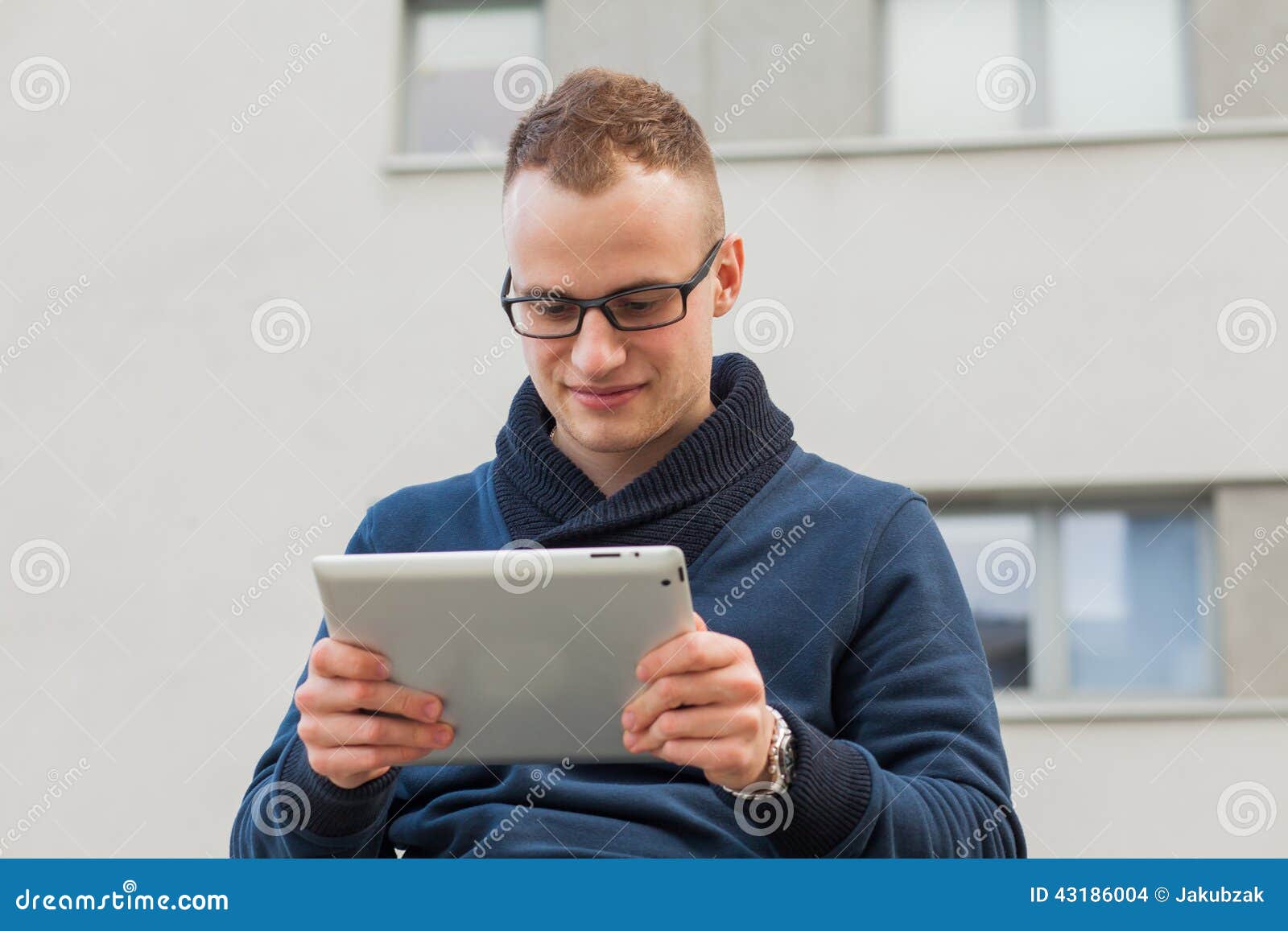 Stylish Guy Connected on Internet with Tablet in Town. he is Hap Stock ...