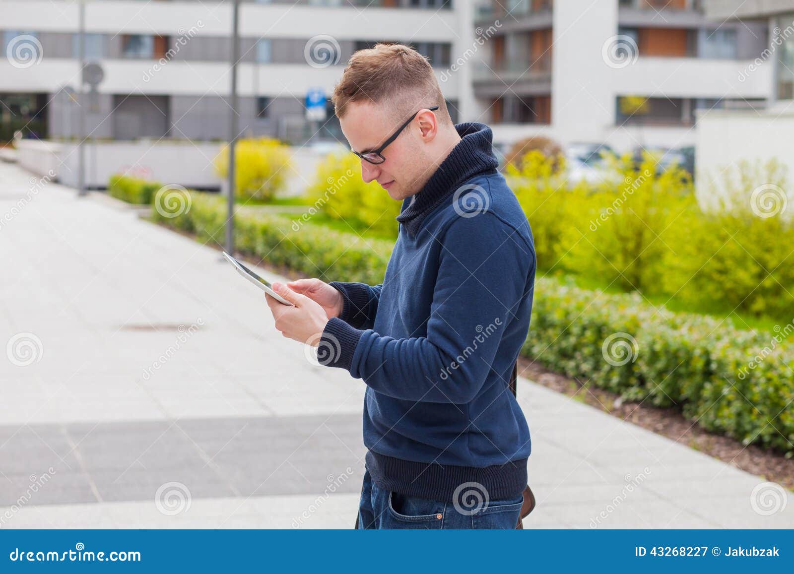 Stylish Guy Connected on Internet with Tablet in Town. he is Hap Stock ...