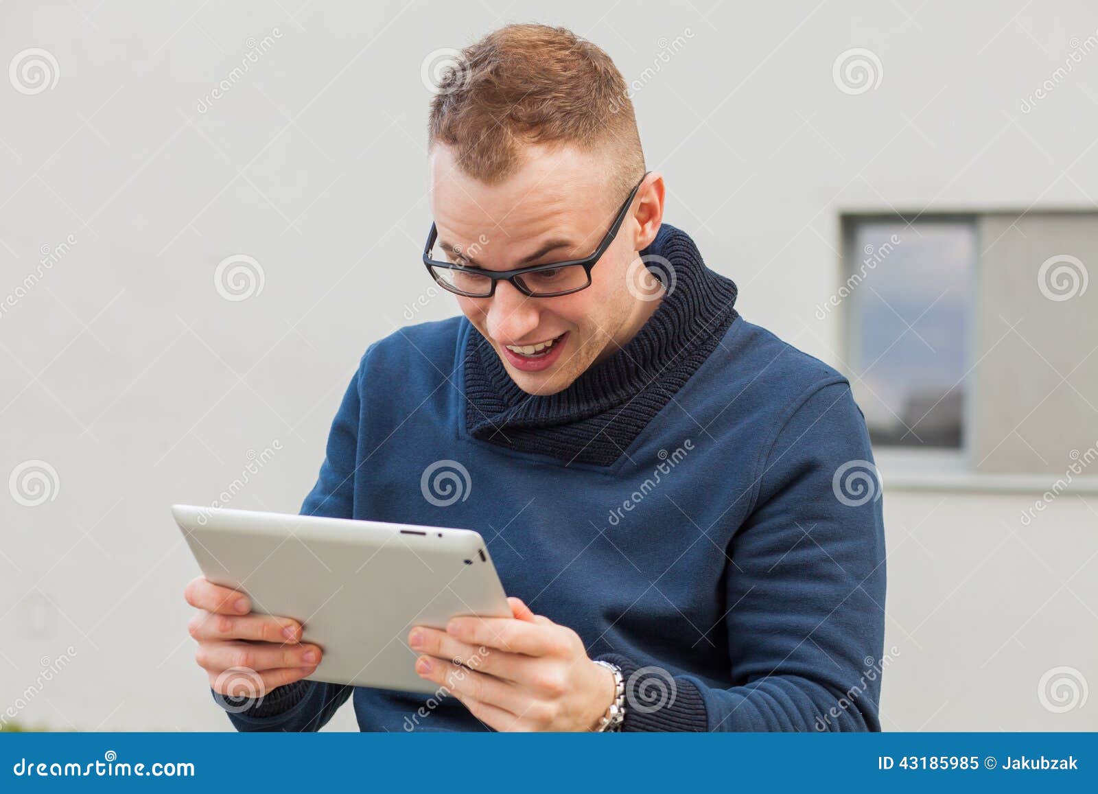 Stylish Guy Connected on Internet with Tablet in Town. he is Surprised ...