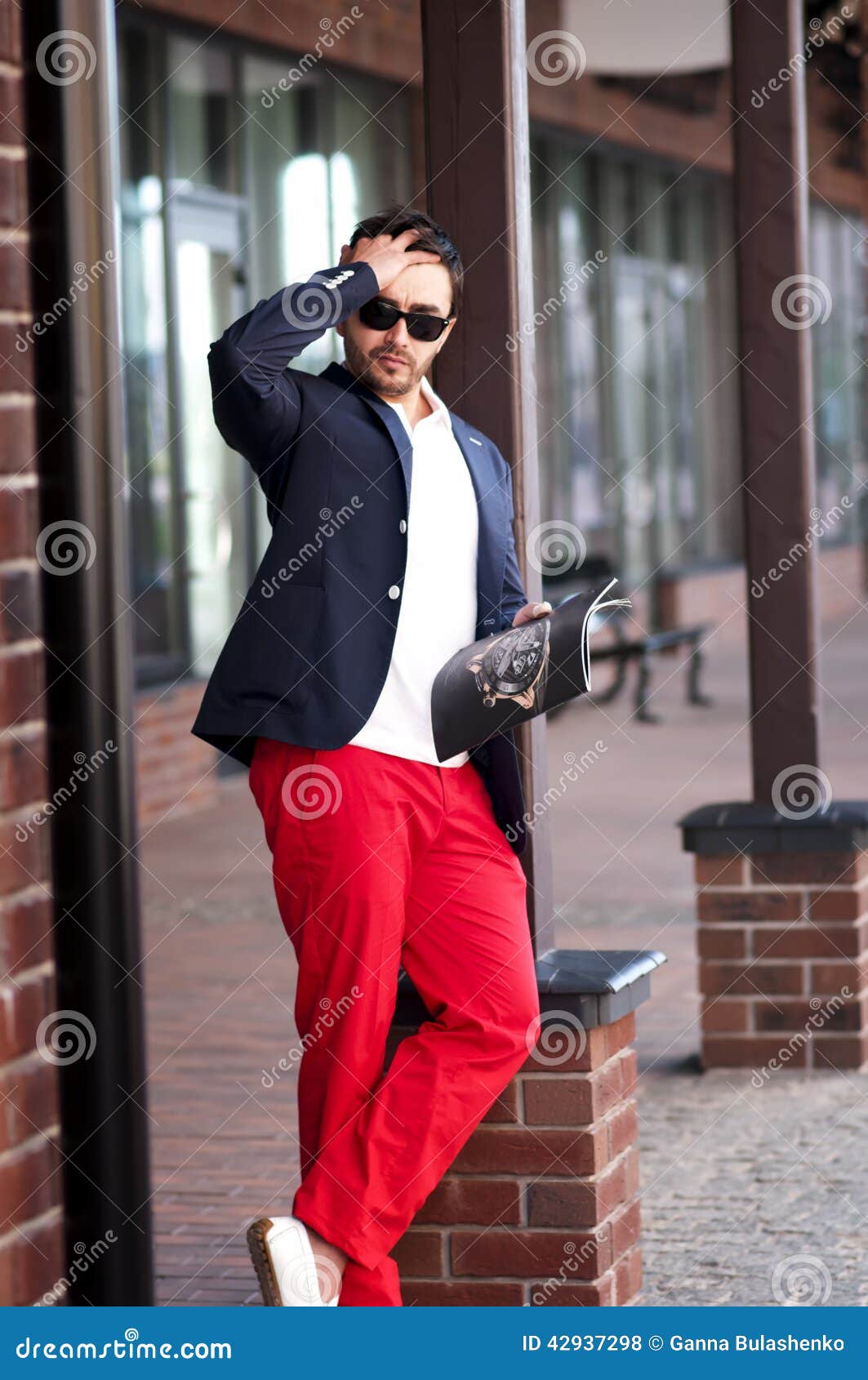 Stylish Handsome Man Reading a Magazine on Walks. Stock Photo - Image ...