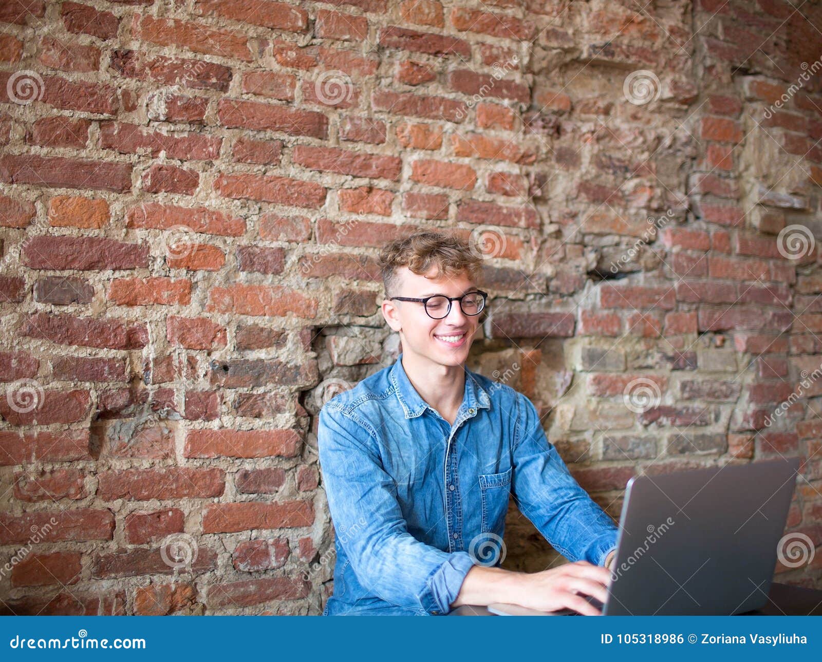 Young Man Freelancer Working on His Web Site on Portable Laptop ...