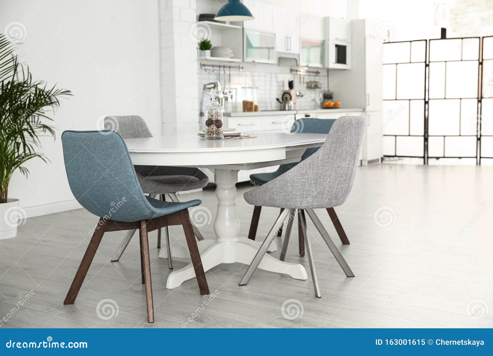 Stylish Kitchen Interior with Table and Chairs Stock Image - Image of ...