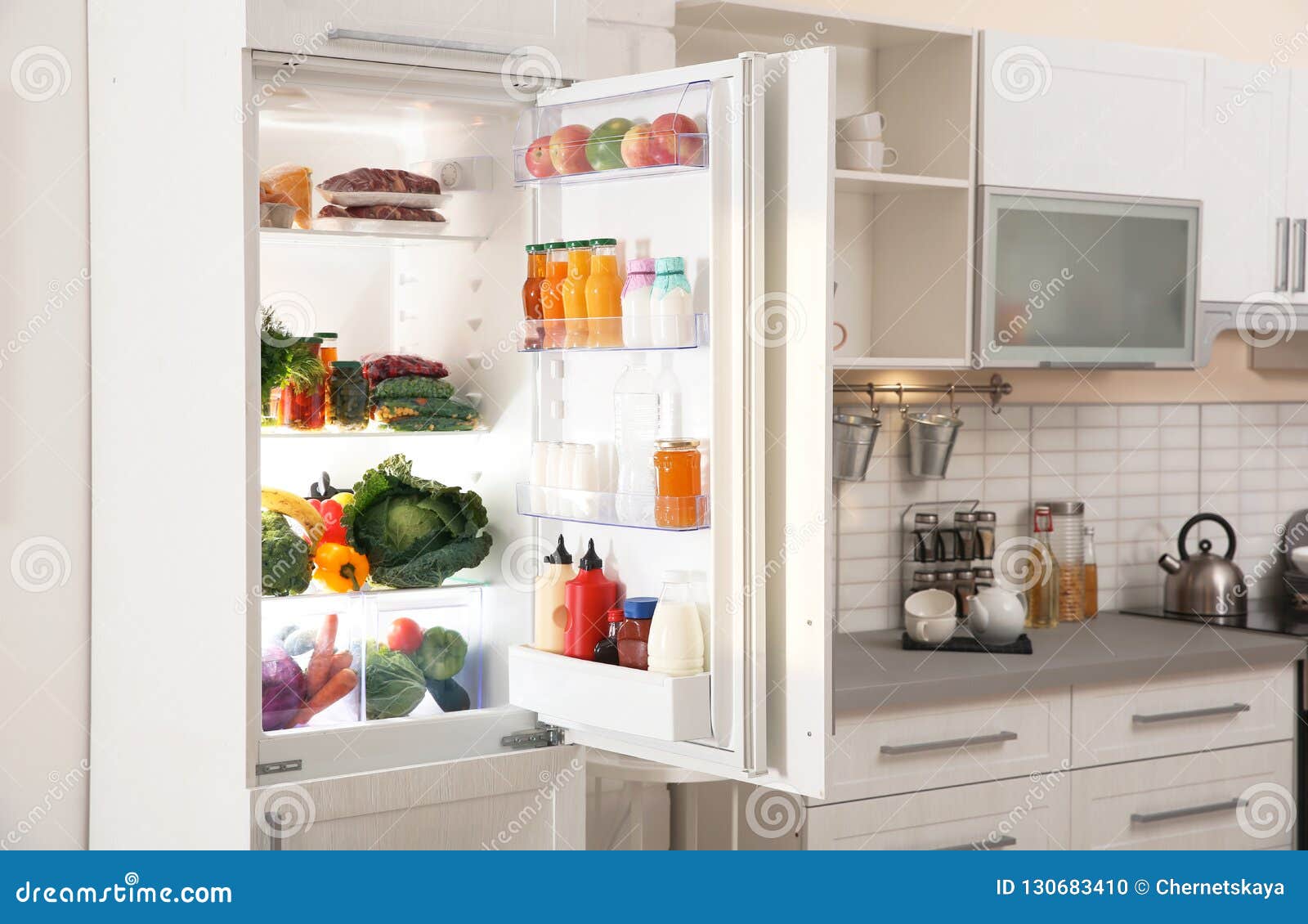 Stylish Kitchen Interior with Refrigerator Full Stock Photo - Image of ...