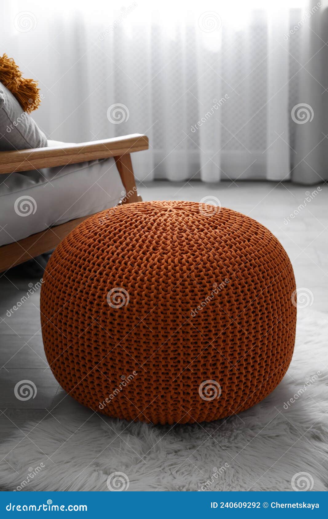 Stylish Knitted Pouf on Floor in Room. Interior Design Stock Photo ...