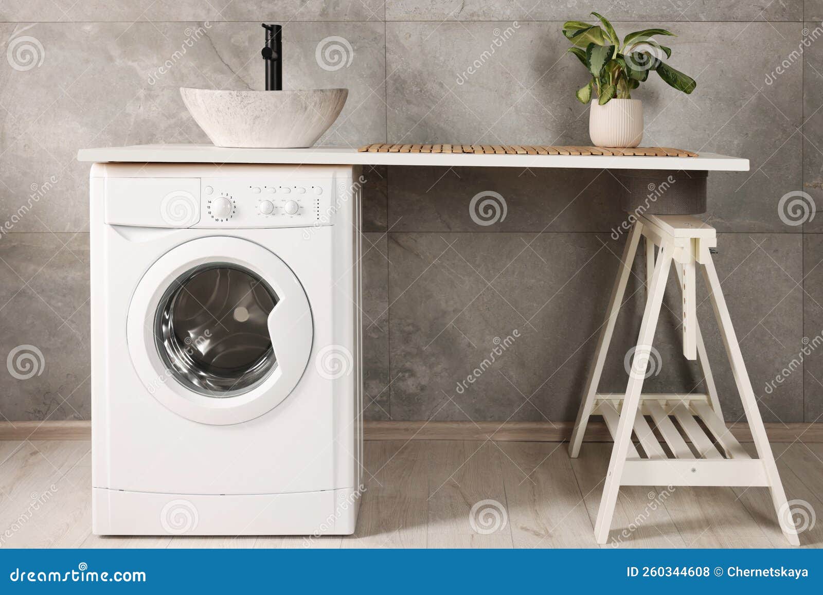 Stylish Laundry Room with Modern Washing Machine. Interior Design Stock ...