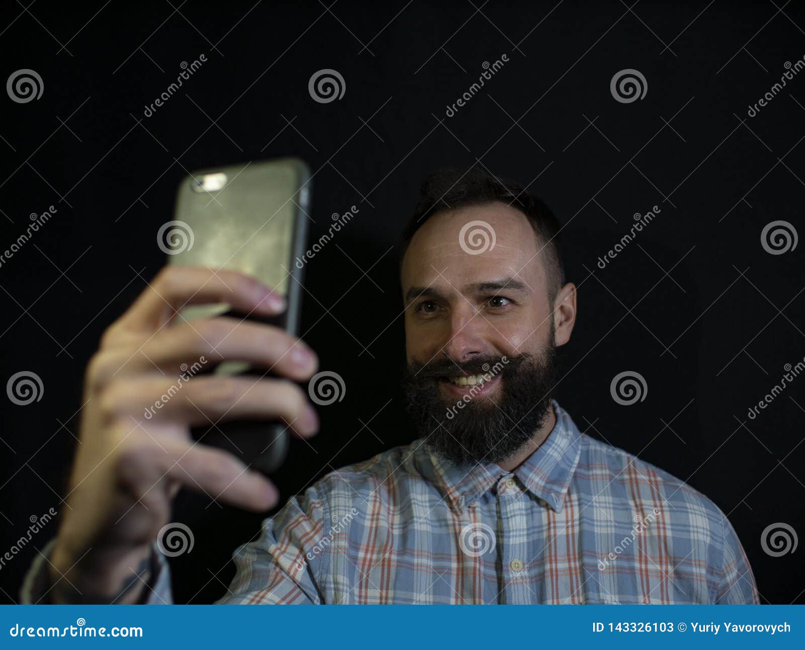 Stylish Man With A Beard And Mustache Smiles And Takes A Selfie On The