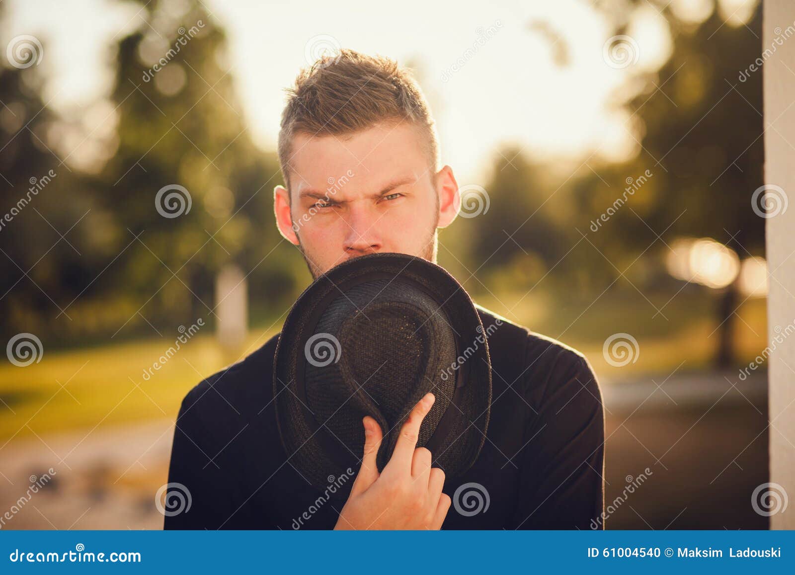 Stylish Man Holding Hat. Close-up Stock Photo - Image of face, modern ...